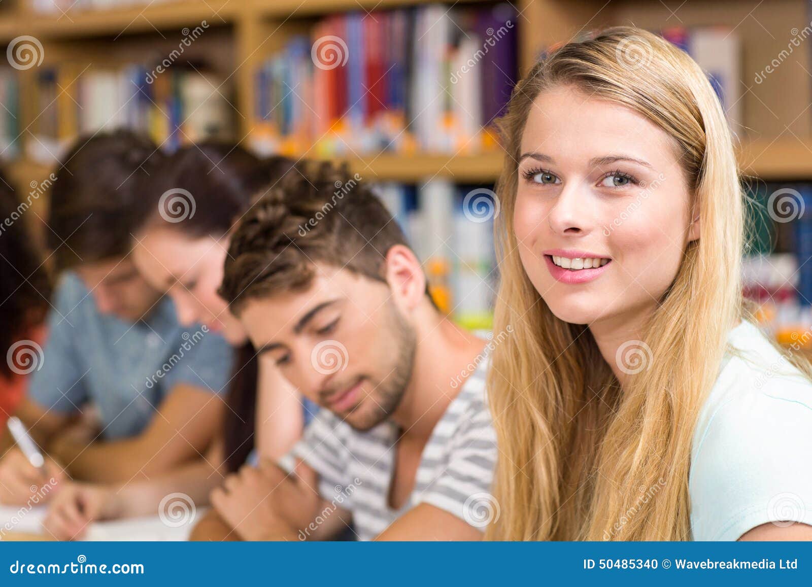 College Students Doing Homework in Library Stock Photo - Image of four ...