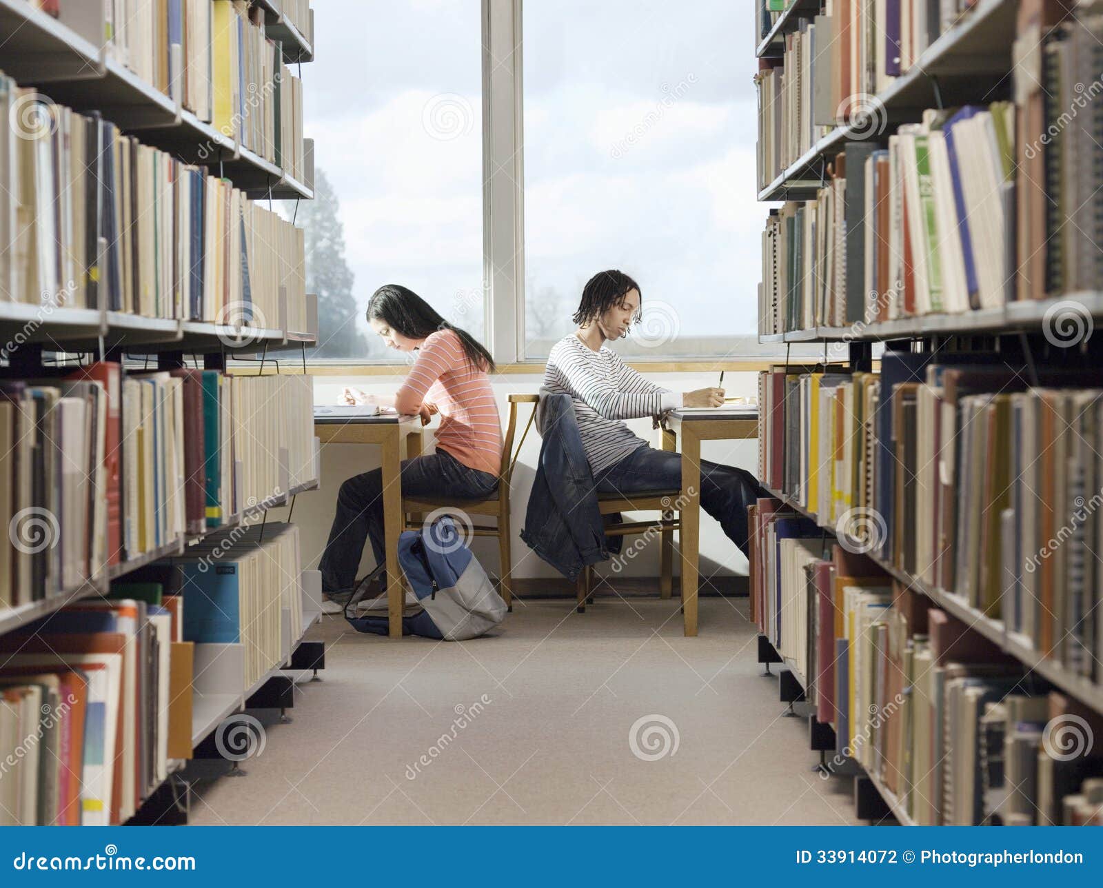 College Students Doing Homework in Library Stock Photo - Image of ...