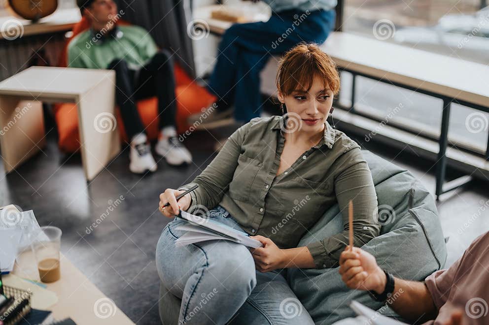 College Students Engaging with Students in a Casual Study Session Stock ...