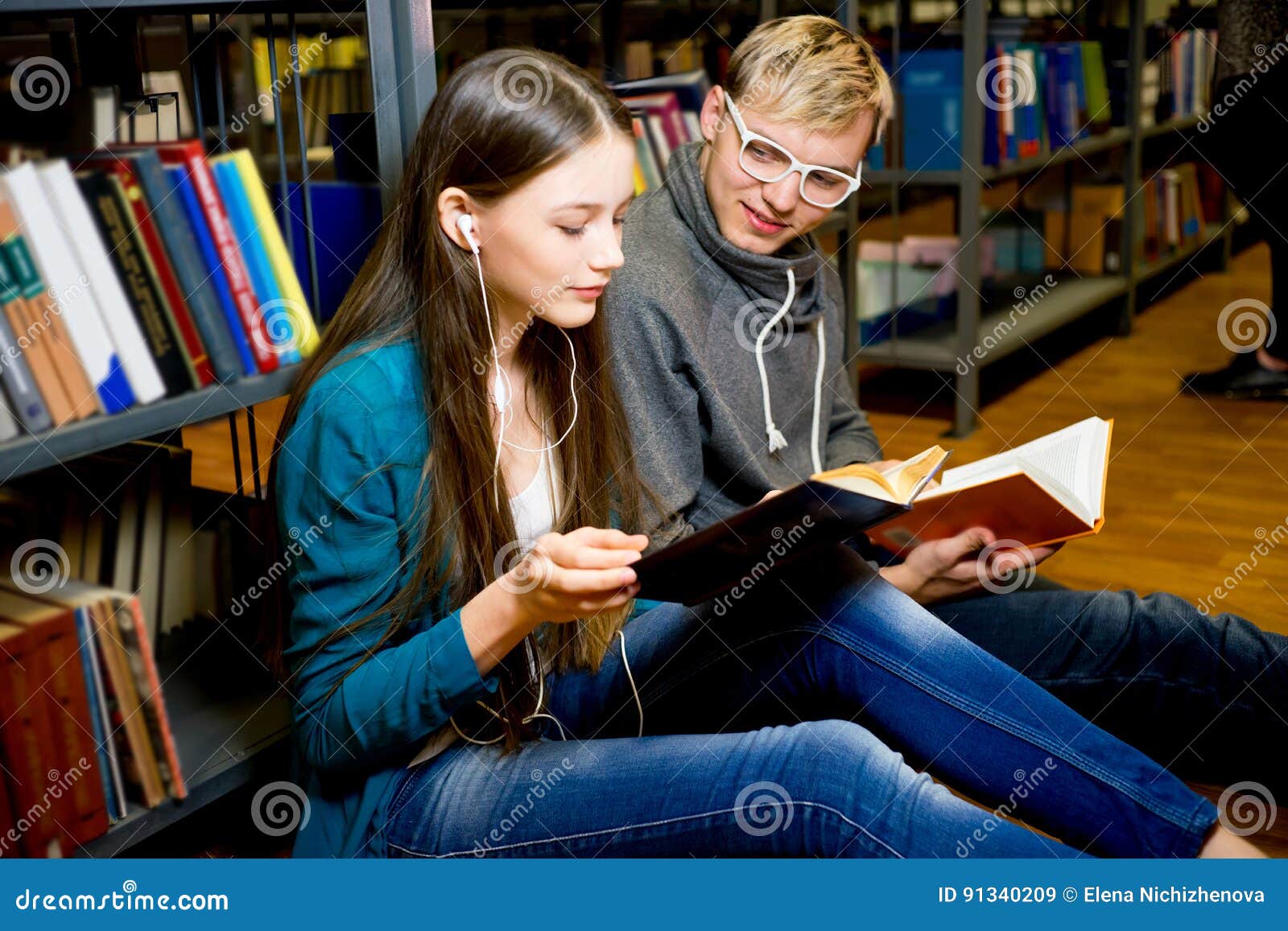 College Students in Library Stock Image - Image of serious, studying ...