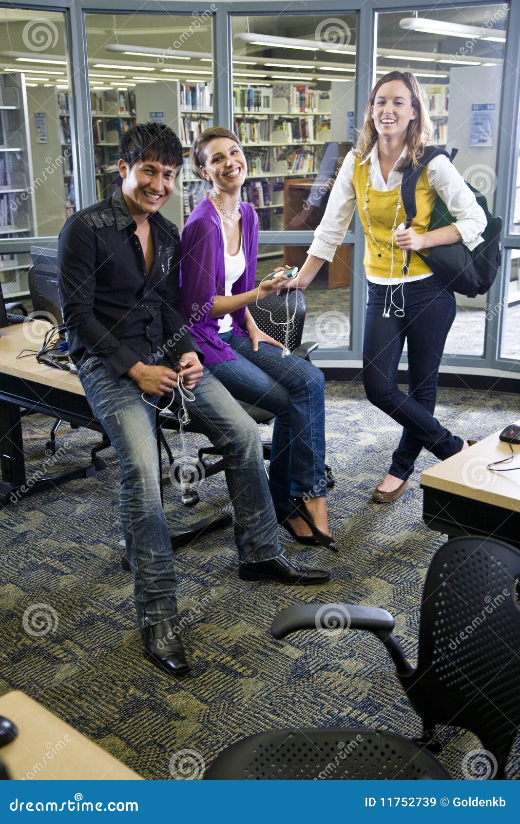 College Students with Music Players in Library Stock Image - Image of ...