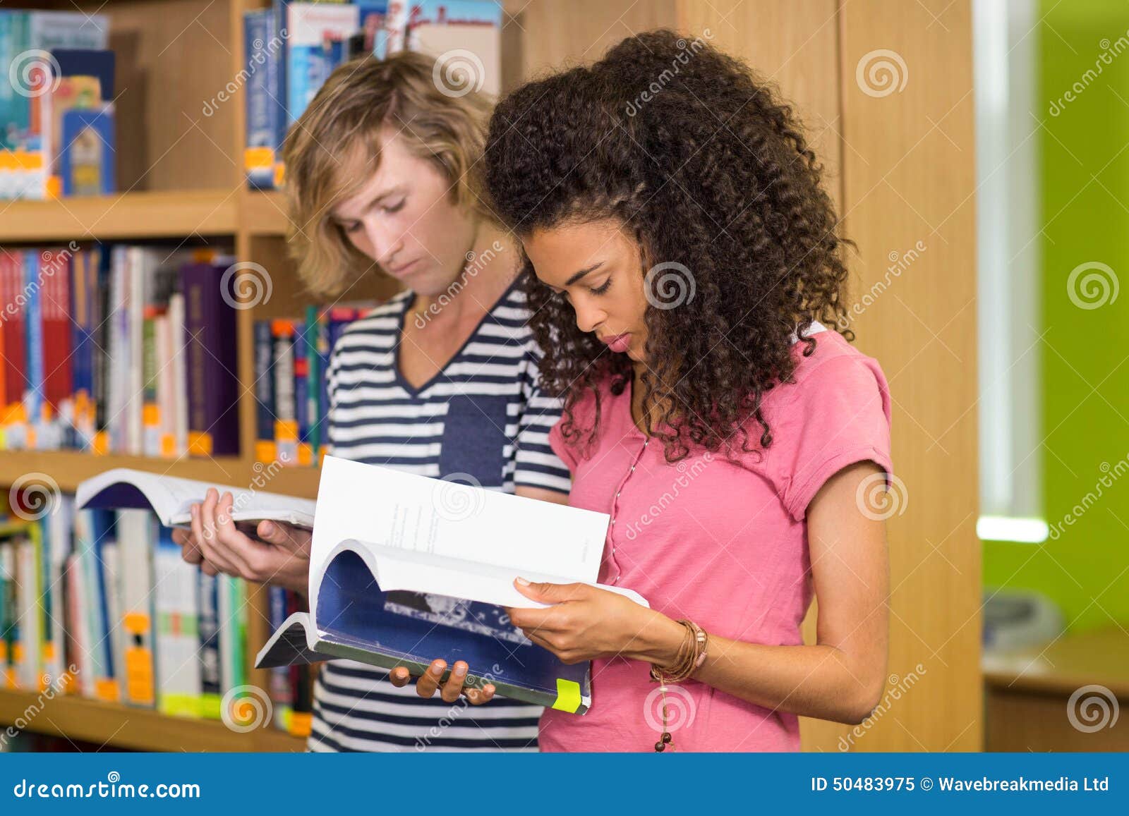 College Students Reading Books in Library Stock Image - Image of ...
