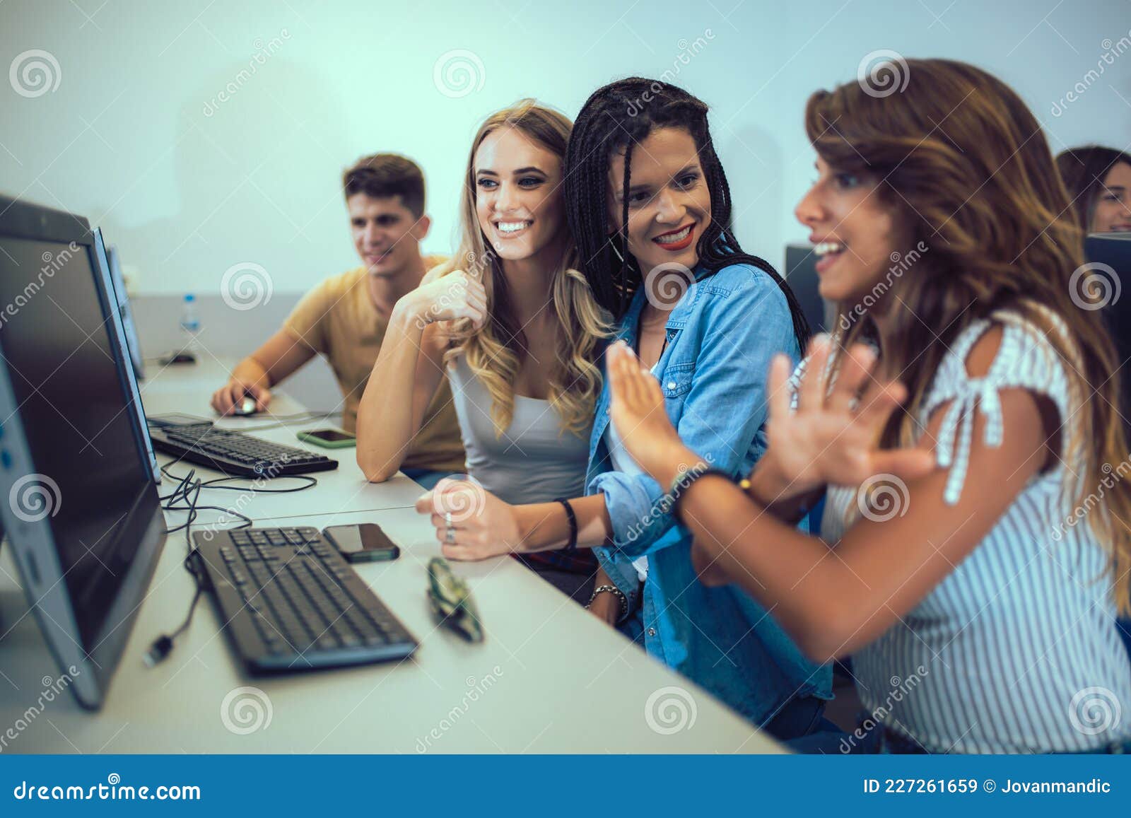 Students Sitting in a Classroom, Using Computers during Class Stock ...