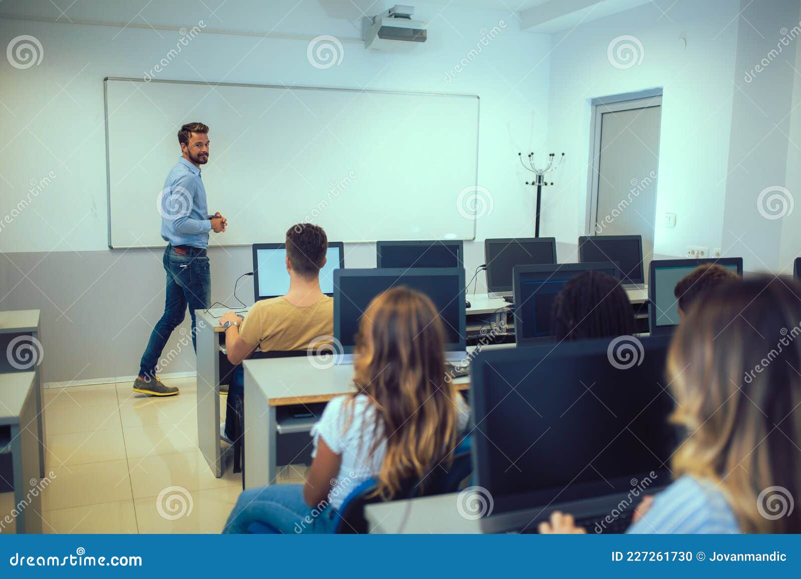 Students Sitting in a Classroom, Using Computers during Class Stock ...