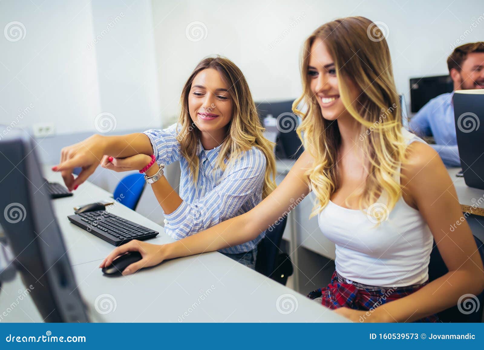 College Students Sitting in a Classroom, Using Computers Stock Image ...