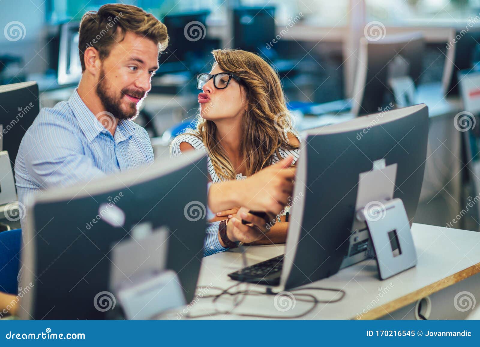 Students Sitting in a Classroom, Using Computers during Class Stock ...