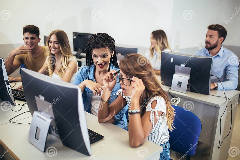 Students Sitting in a Classroom, Using Computers during Class Stock ...