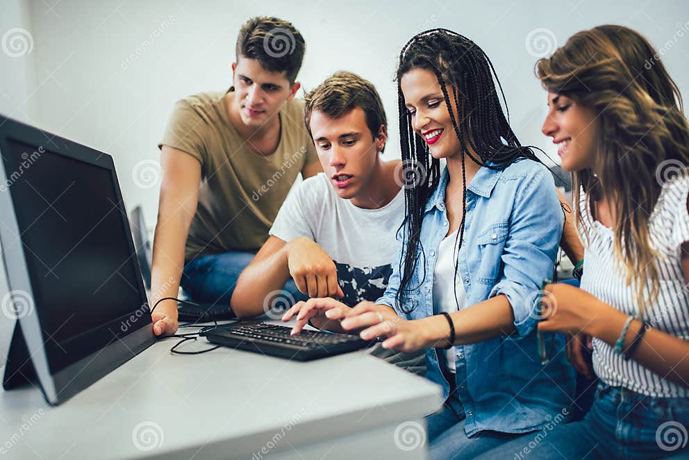 Students Sitting in a Classroom, Using Computers during Class Stock ...