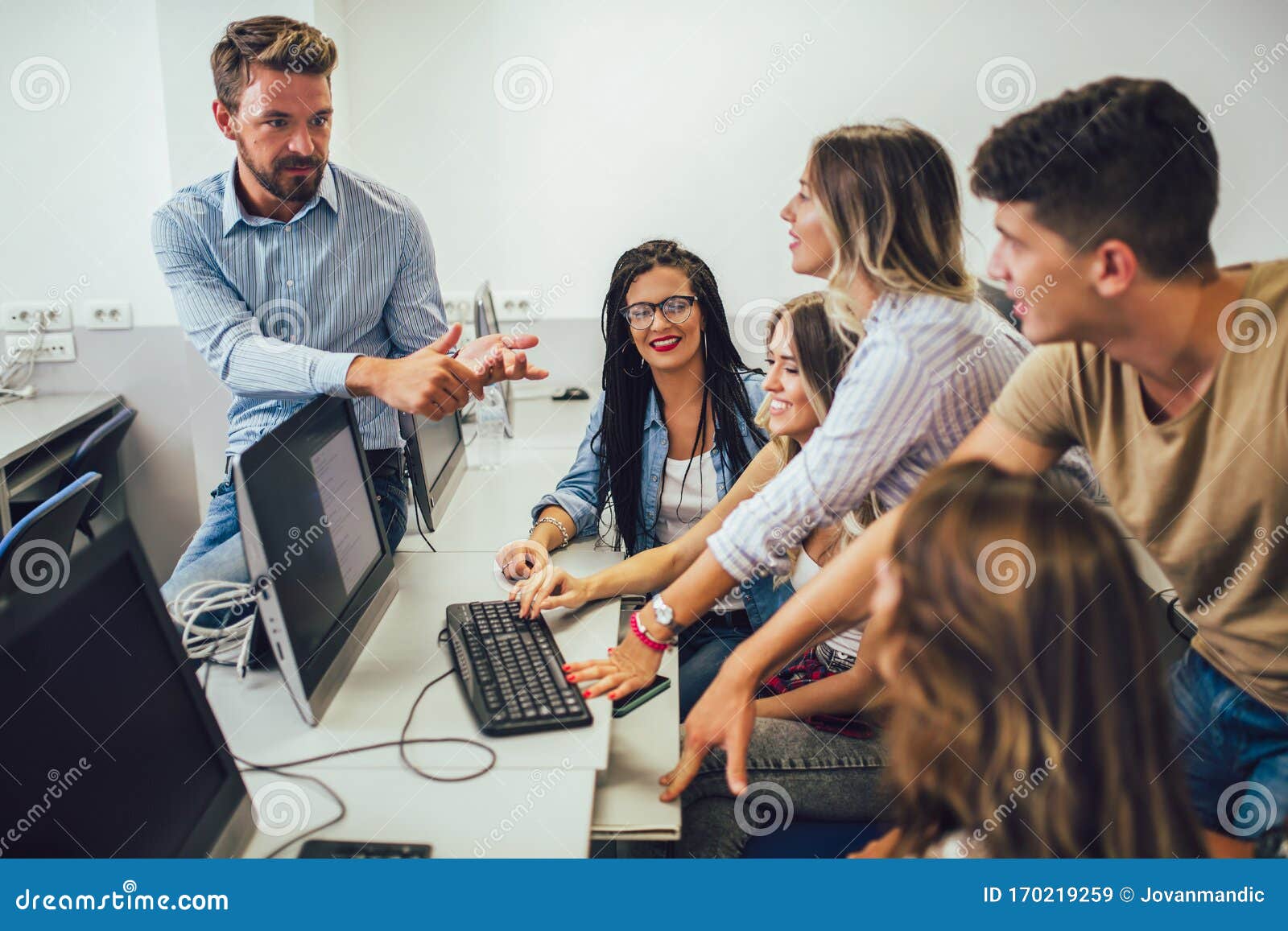 Students Sitting in a Classroom, Using Computers during Class Stock ...