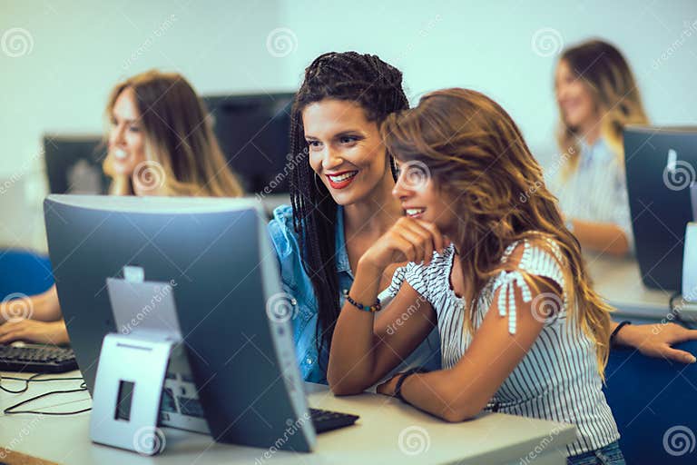 Students Sitting in a Classroom, Using Computers during Class Stock ...