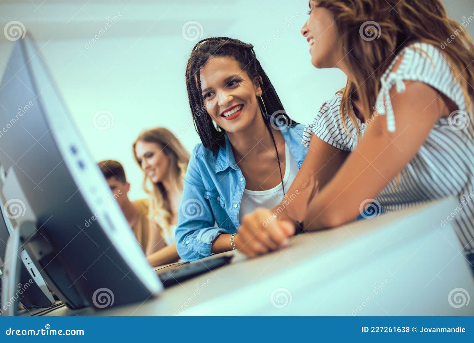 Students Sitting in a Classroom, Using Computers during Class Stock ...