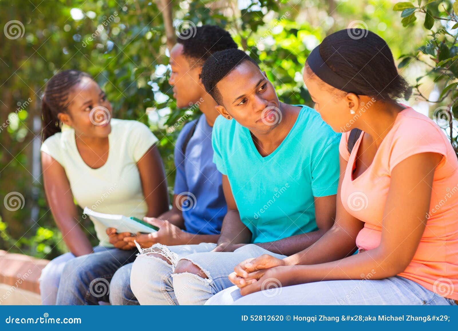 College Students Sitting Outdoors Stock Photo - Image of group, adult ...