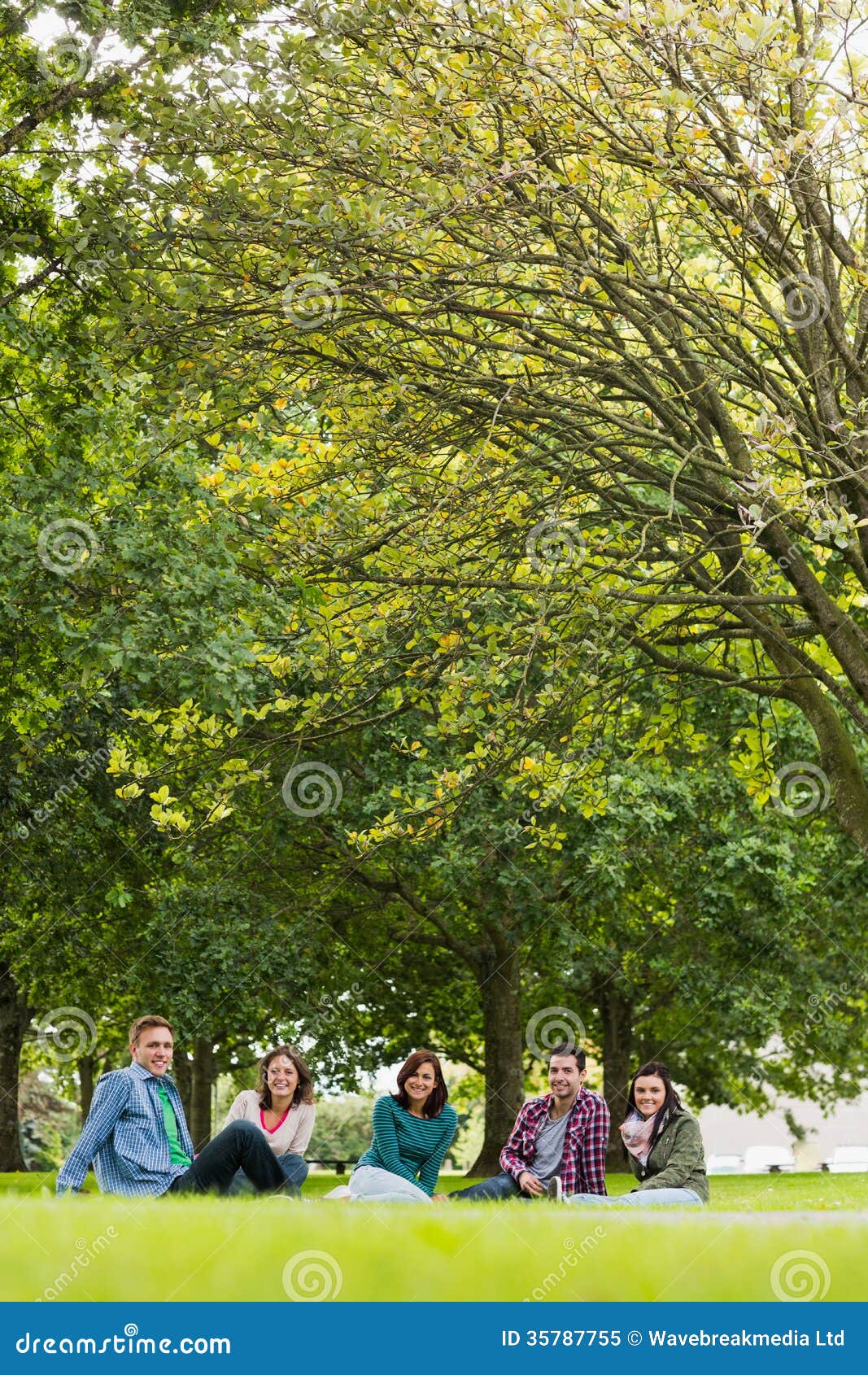 College Students Sitting in Park Stock Image - Image of together, lawn ...