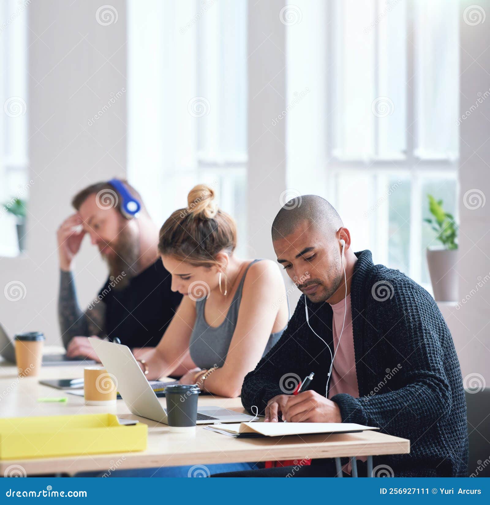 College Students Sitting at Table in Class Working on Project Stock ...