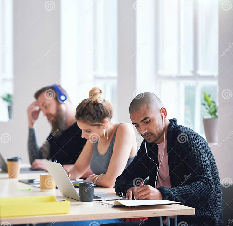 College Students Sitting at Table in Class Working on Project Stock ...