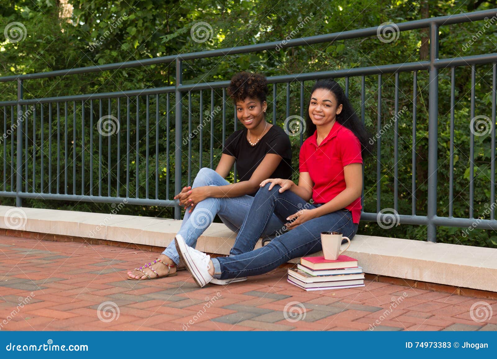 2 College Students Sitting Together on Campus Stock Image - Image of ...