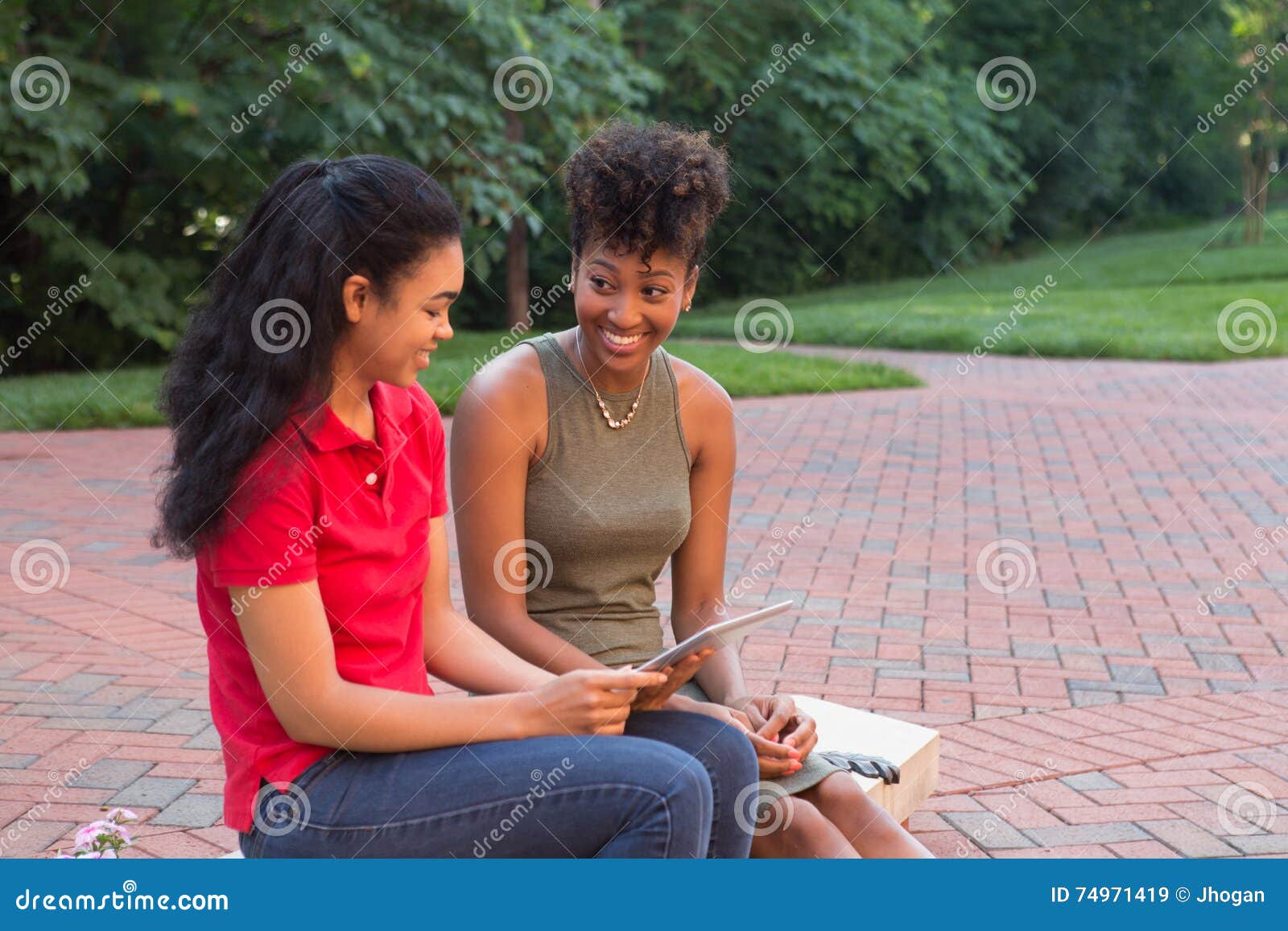 College Students with a Tablet Stock Image - Image of holding, female ...