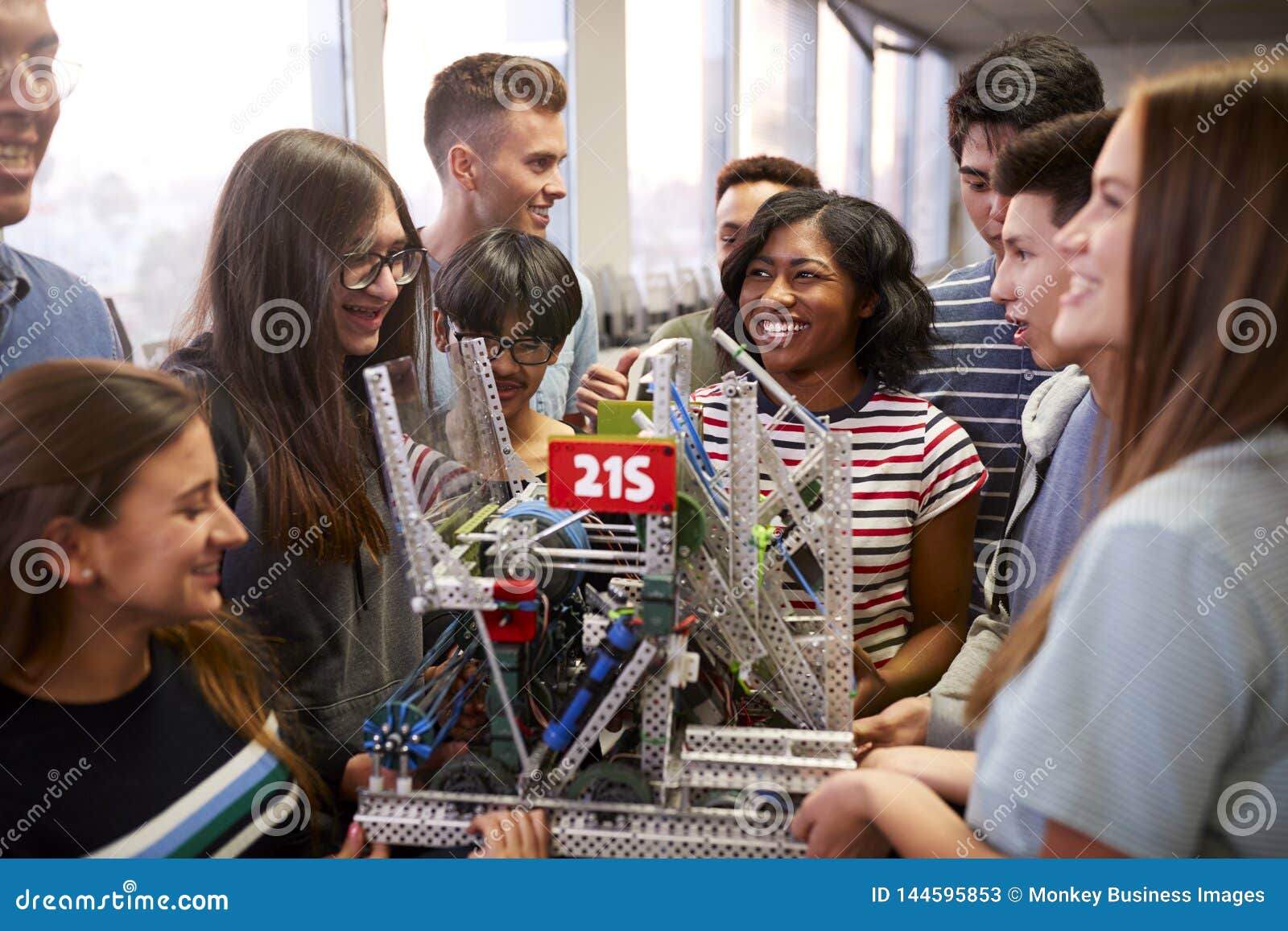 College Students with Teacher Holding Machine in Science or Robotics ...