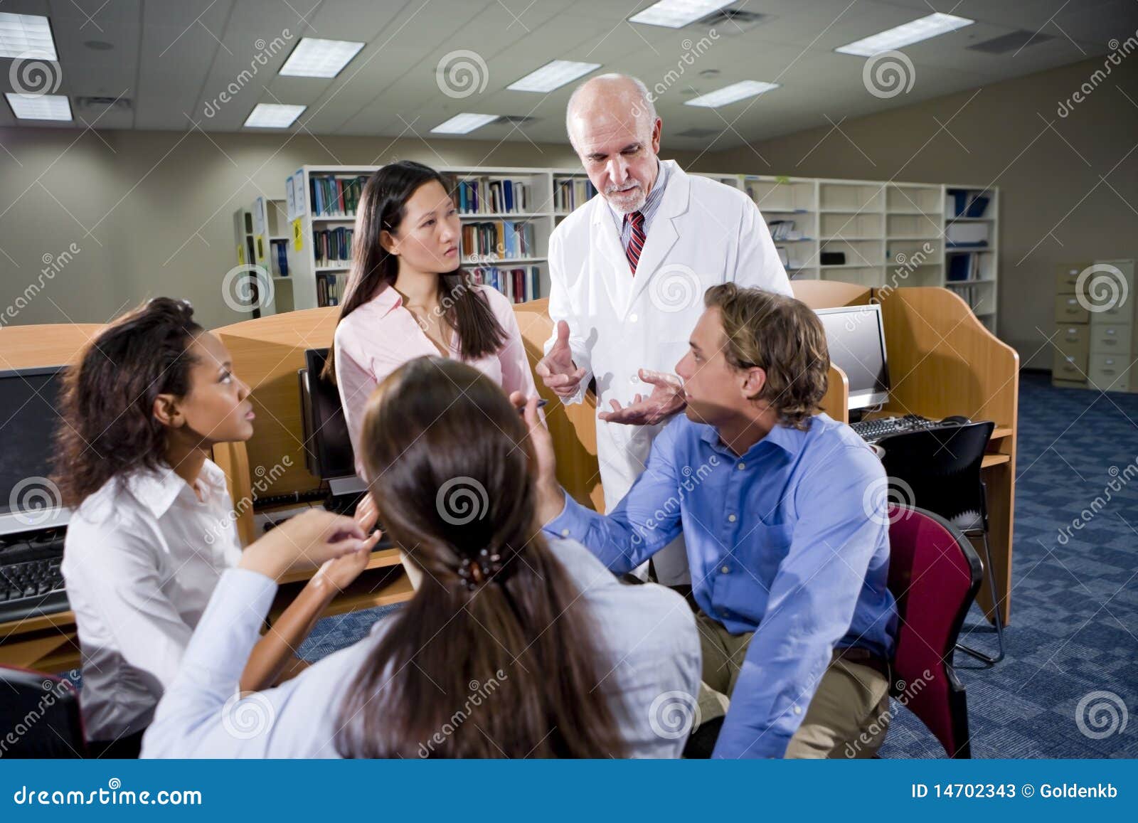 College Students with Teacher Talking in Library Stock Image - Image of ...
