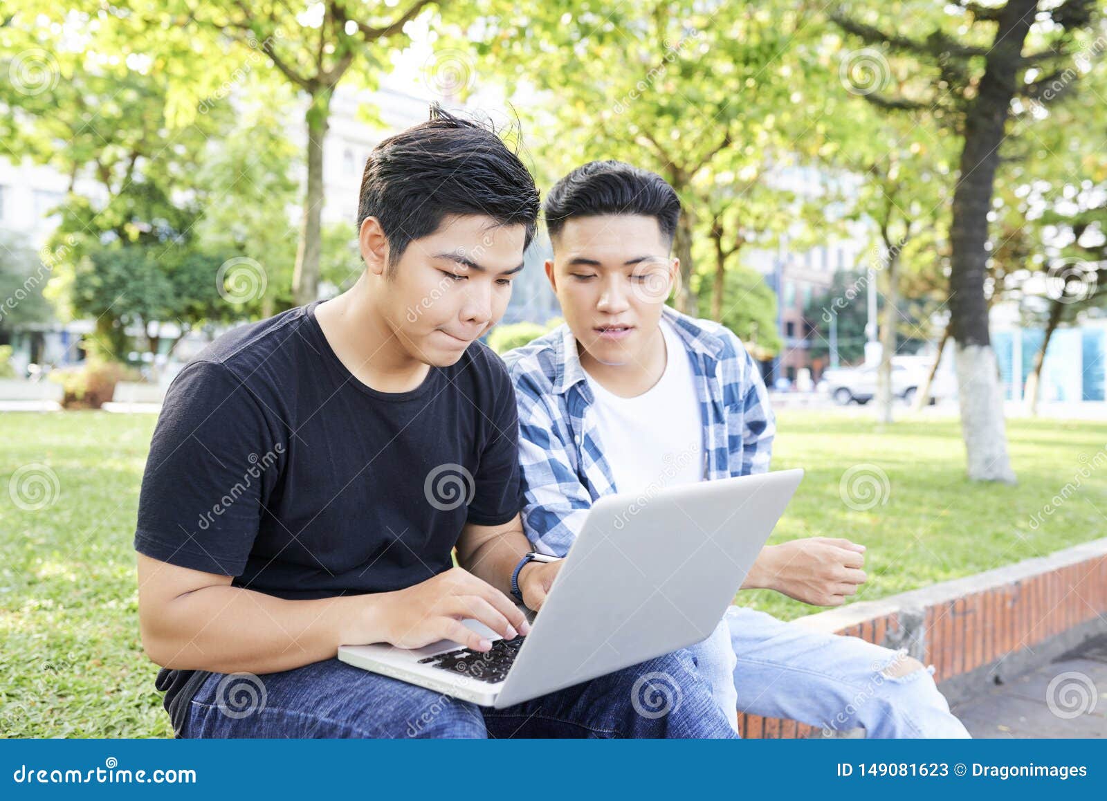 College Students Using Laptop Outdoors Stock Image - Image of wireless ...