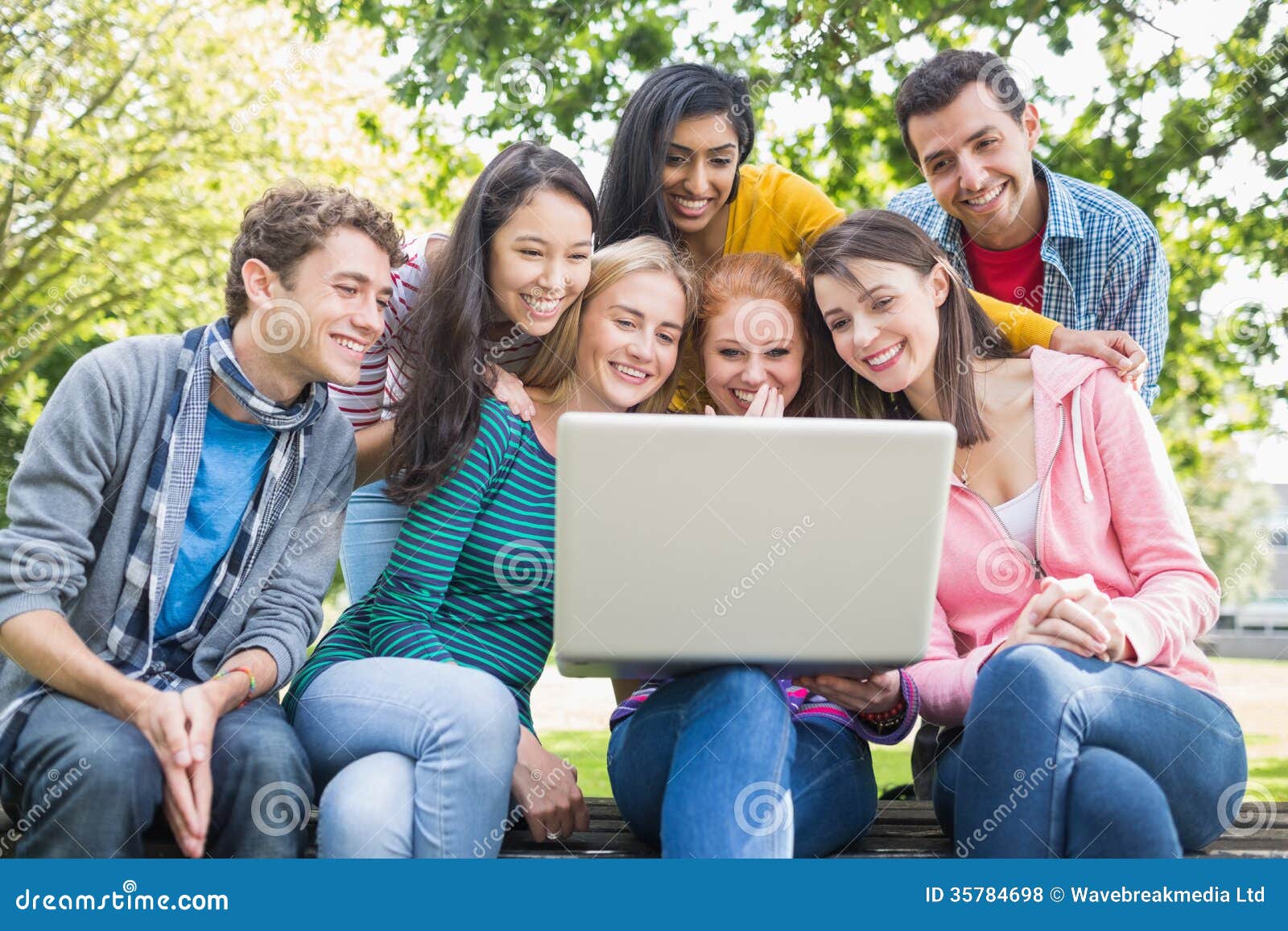 College Students Using Laptop in Park Stock Photo - Image of foreground ...