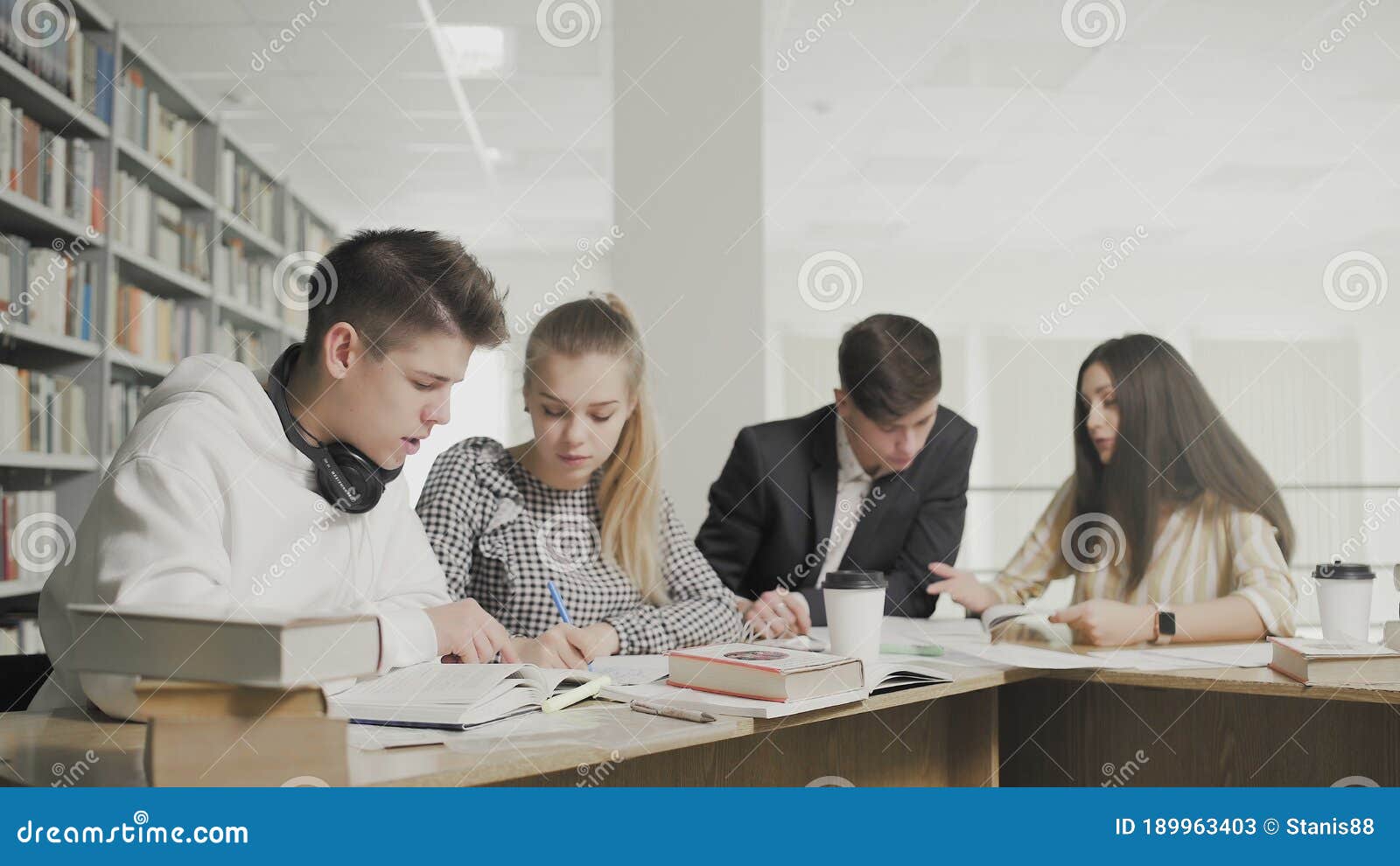 College Students Working Together Preparing for Exams while Sitting at ...