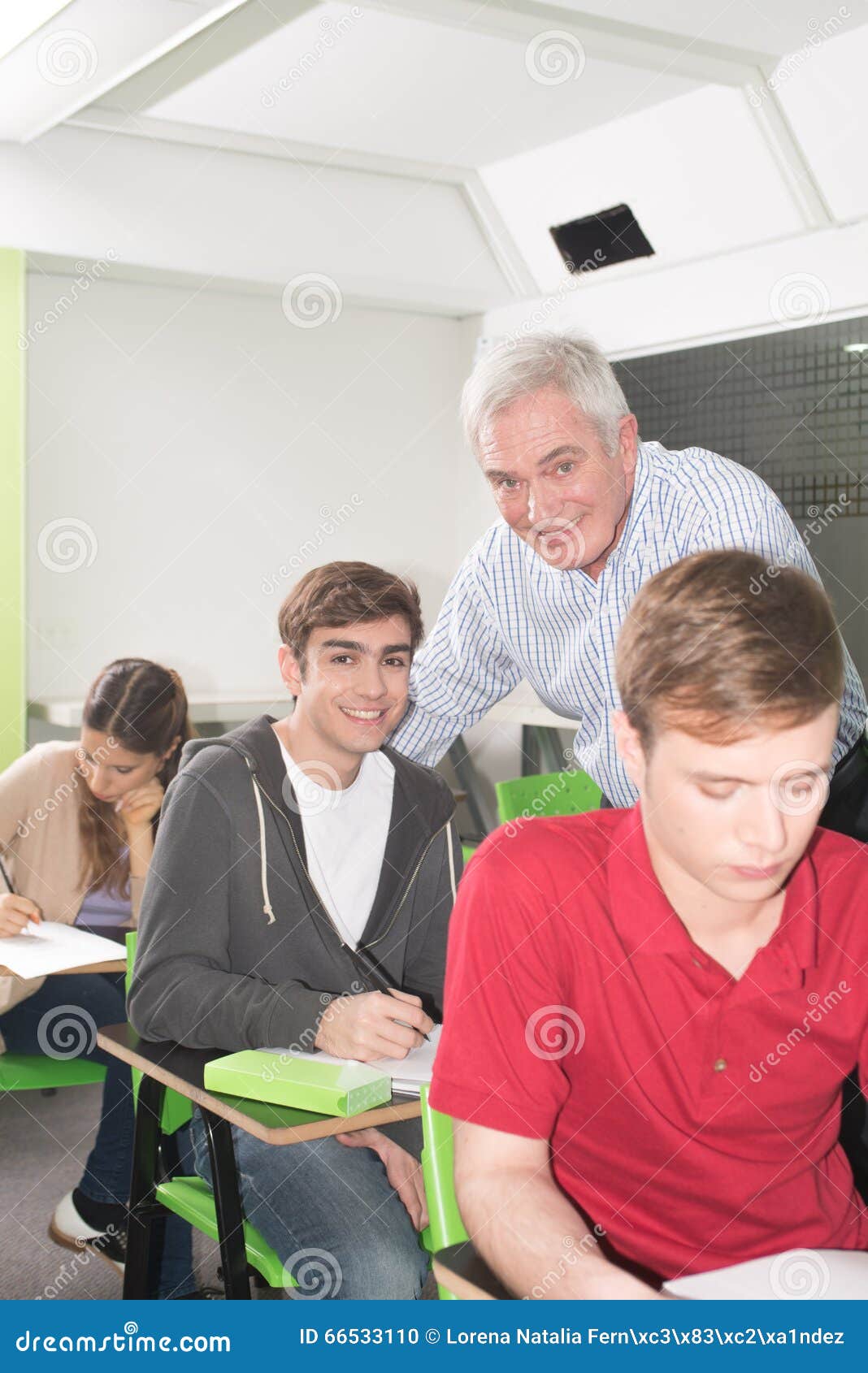 College Teacher Helps His Students Stock Photo - Image of property ...