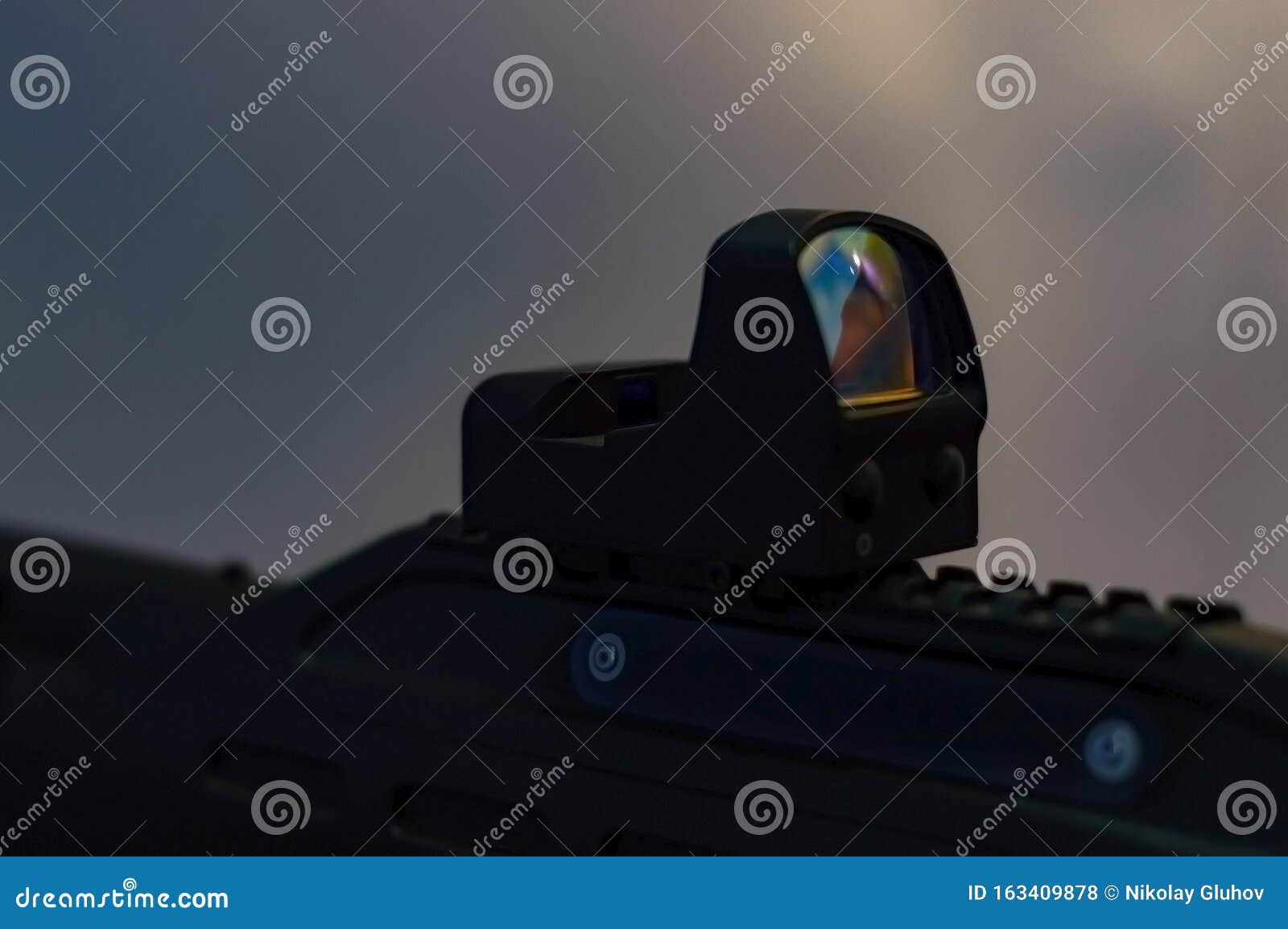 Collimator Sight on a Hand-held Automatic Weapon. Filming in a Low Key ...