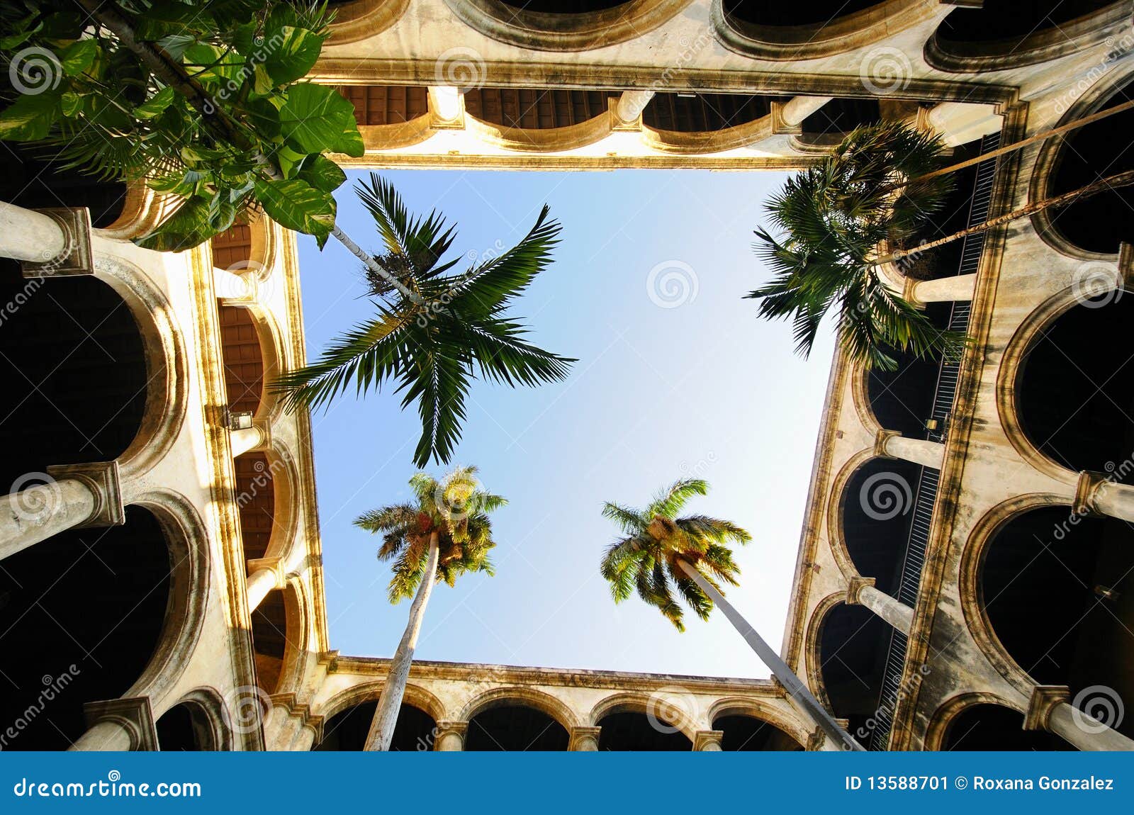 Colonial Building Corner With White Walls, Wooden Windows Under A Deep ...
