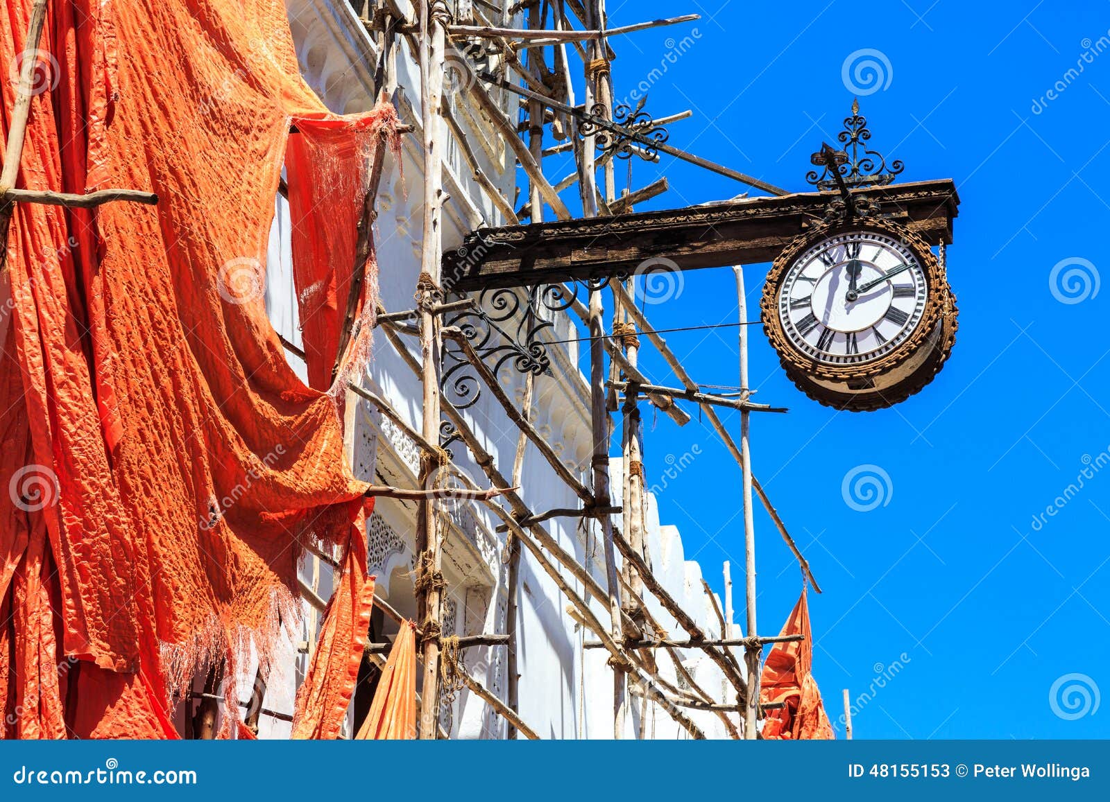Colonial Clock Hanging on an Old Colonial Building Stock Image - Image ...
