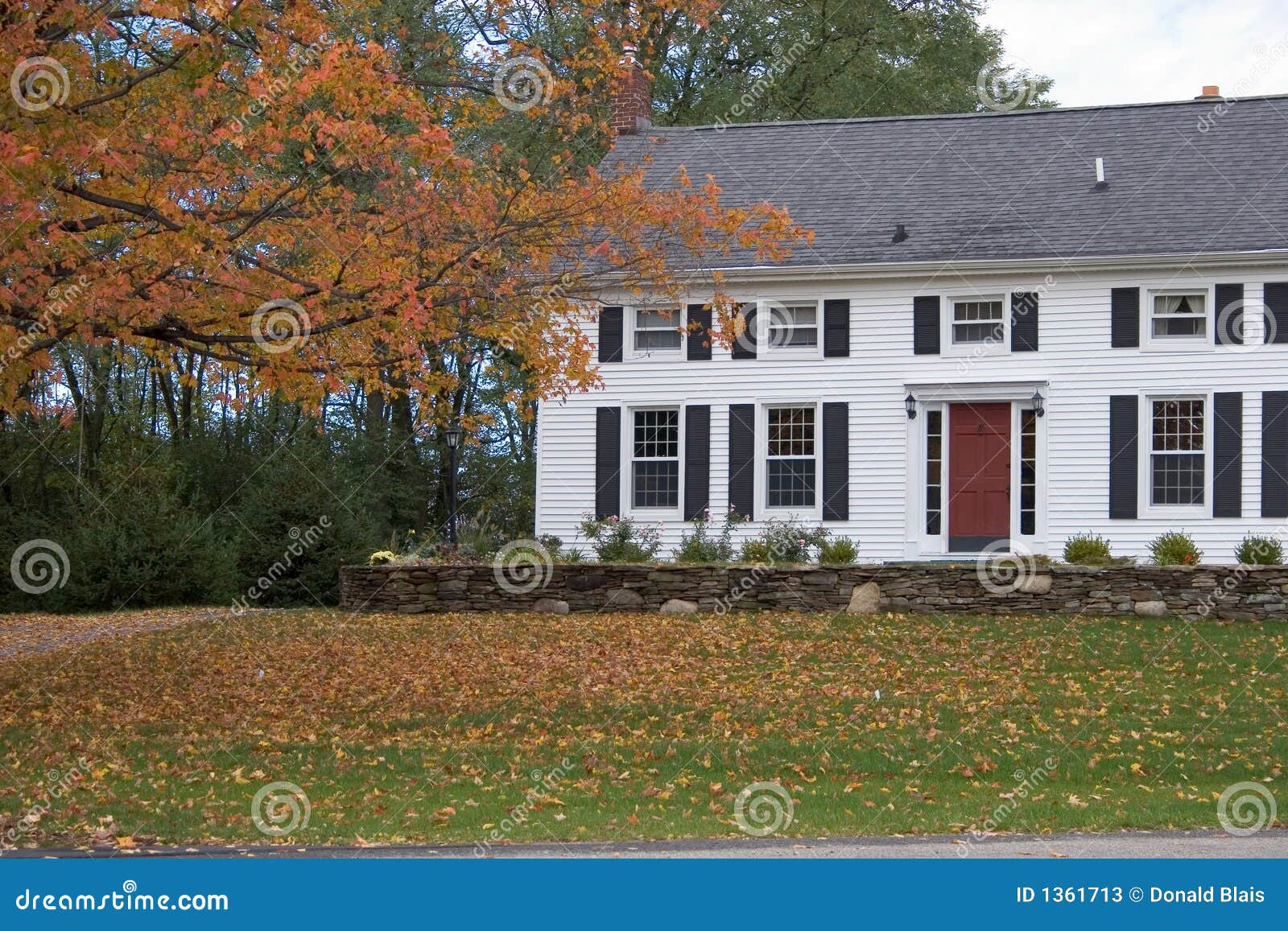 Colonial Home in Autumn stock image. Image of scarecrows - 1361713