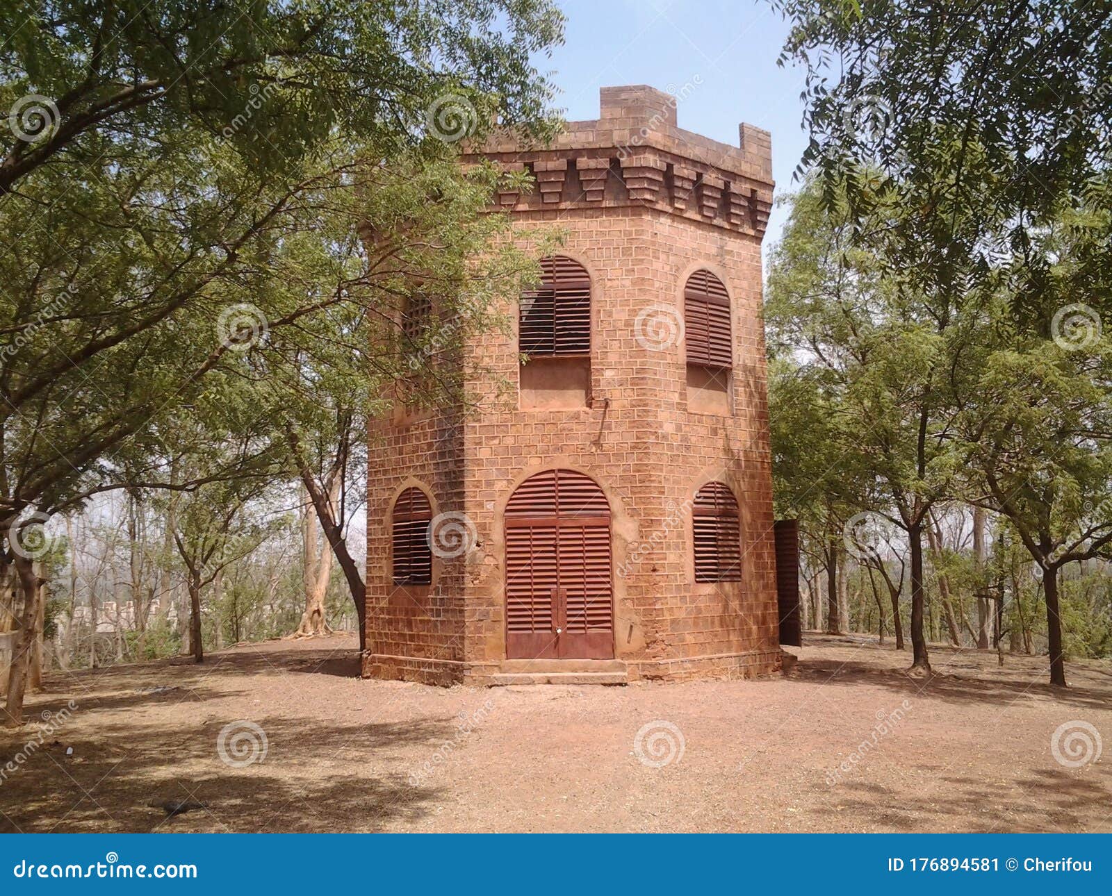 Colonial tower in Sikasso stock image. Image of forest - 176894581