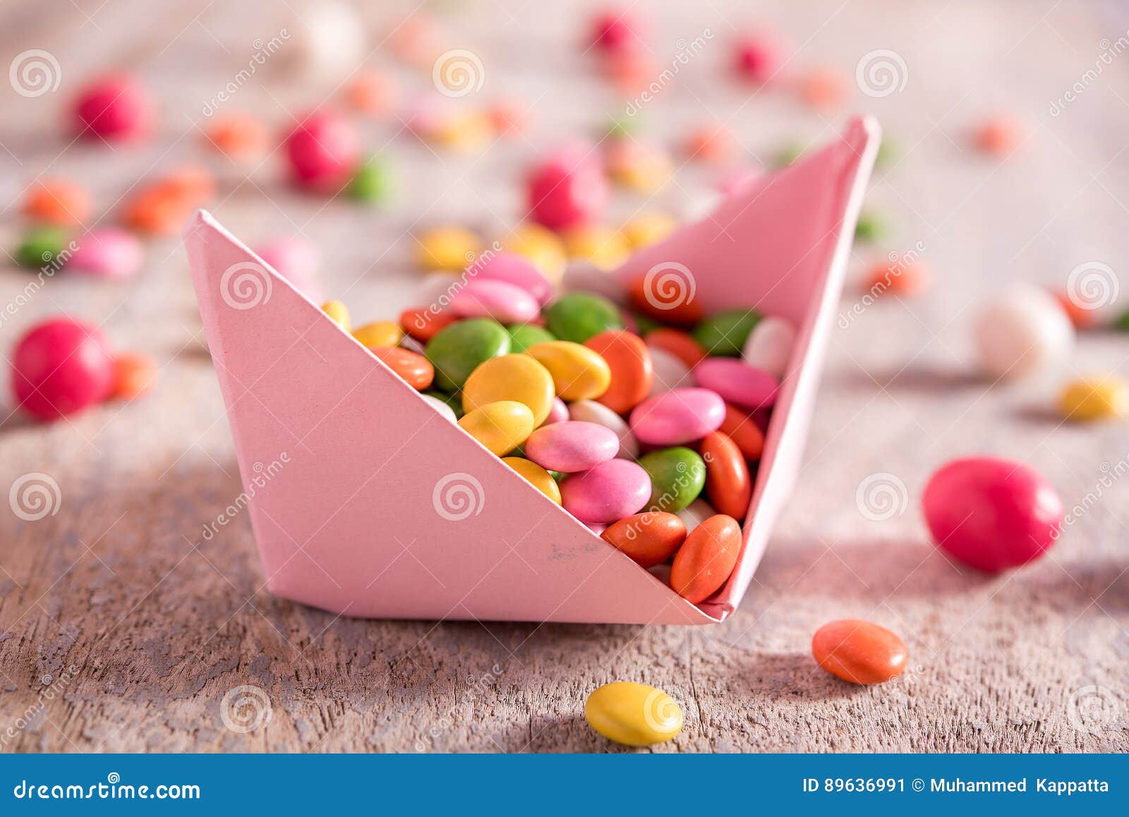 Color candy on paper boat stock image. Image of brown - 89636991