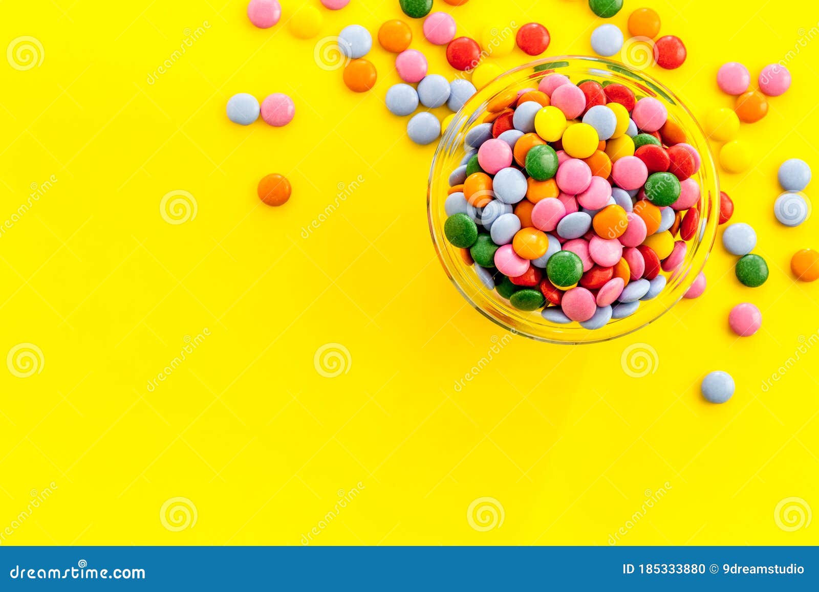 Color Candy on Yellow Table Top-down Copy Space Stock Photo - Image of ...