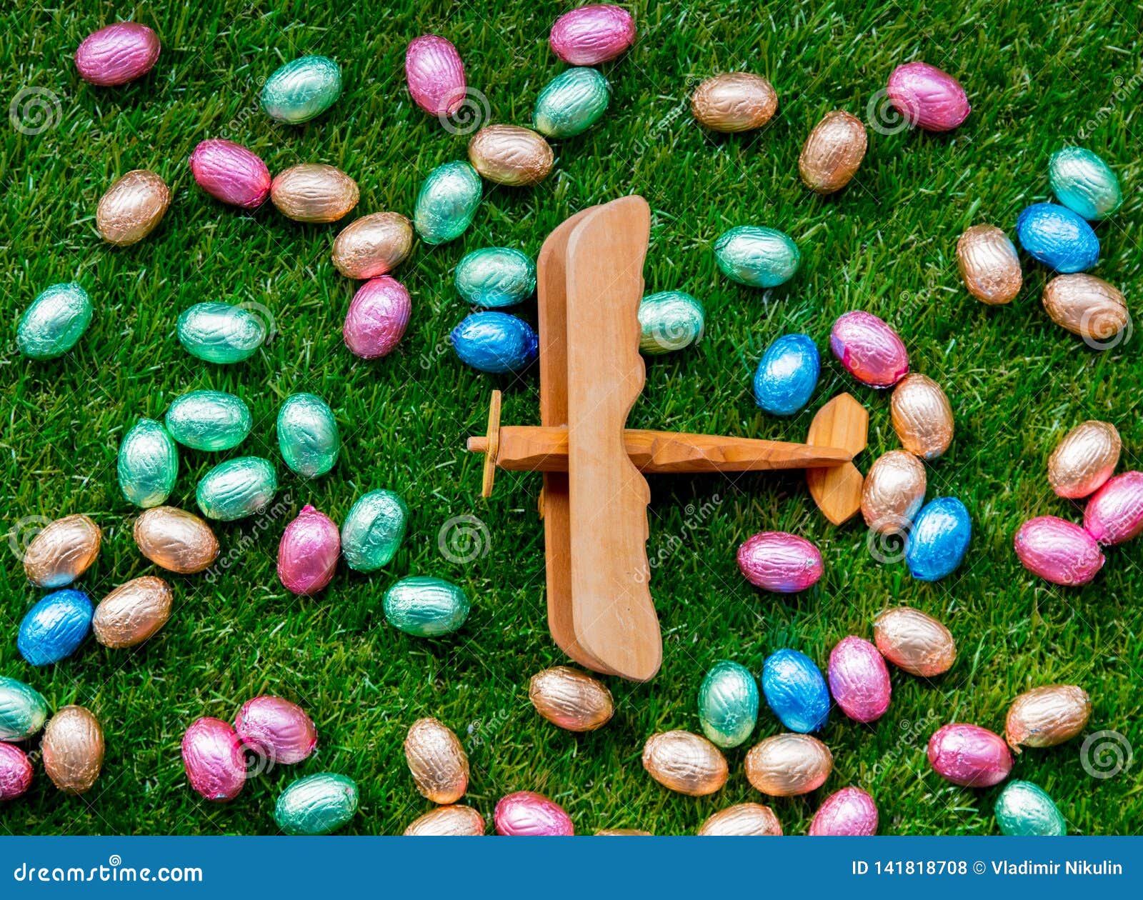 Color Chocolate Easter Eggs and Wooden Airplane Stock Photo - Image of ...