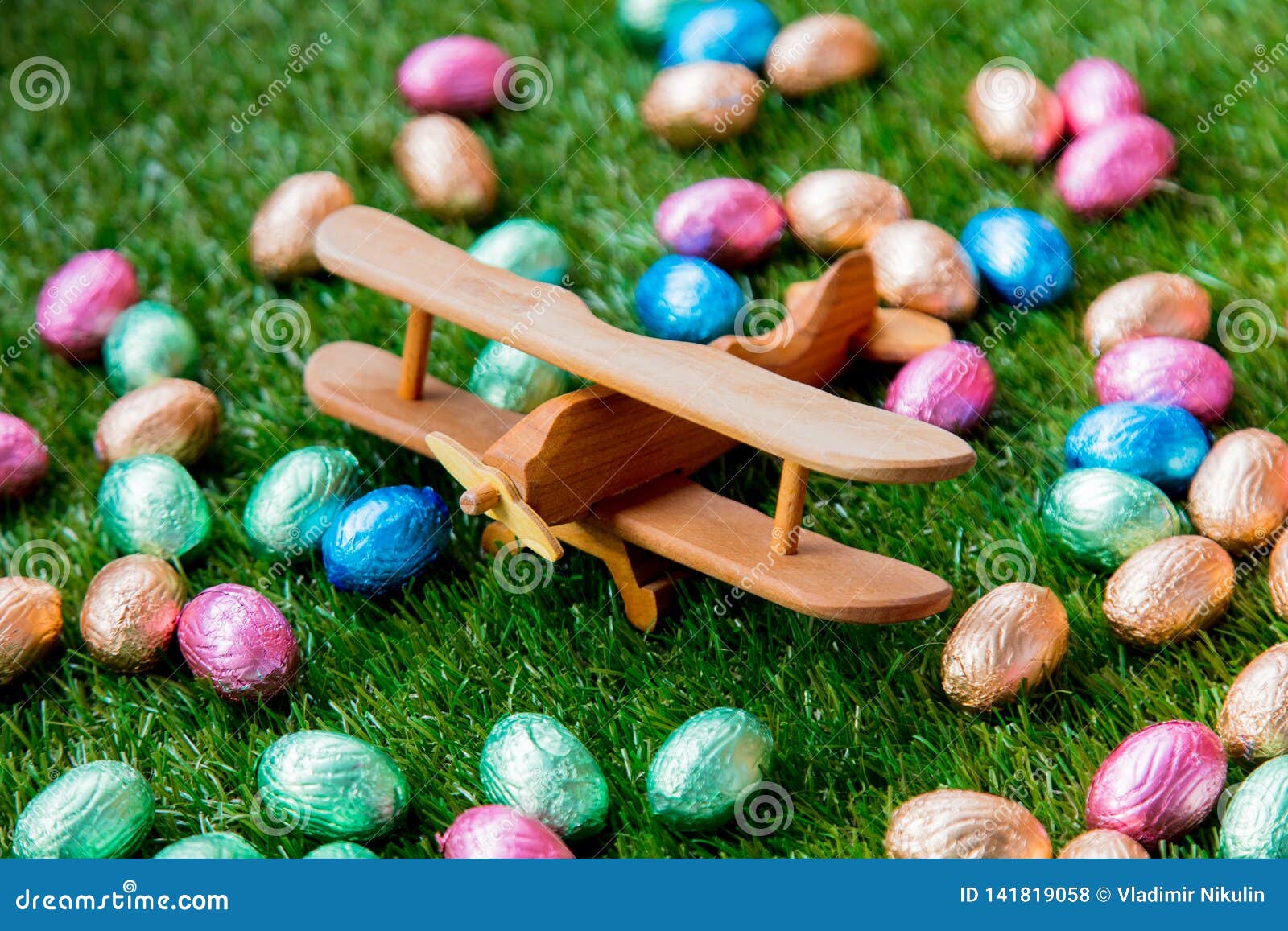 Color Chocolate Easter Eggs and Wooden Airplane Stock Photo - Image of ...