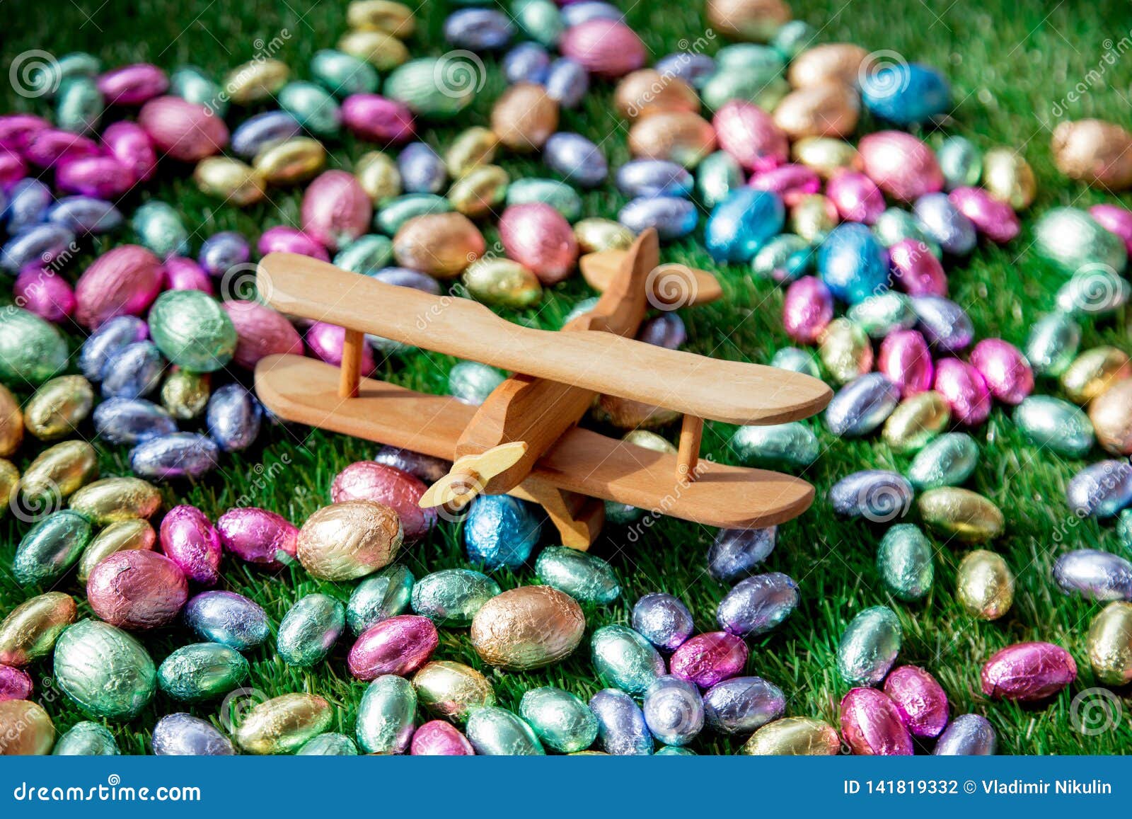 Color Chocolate Easter Eggs and Wooden Airplane Stock Photo - Image of ...