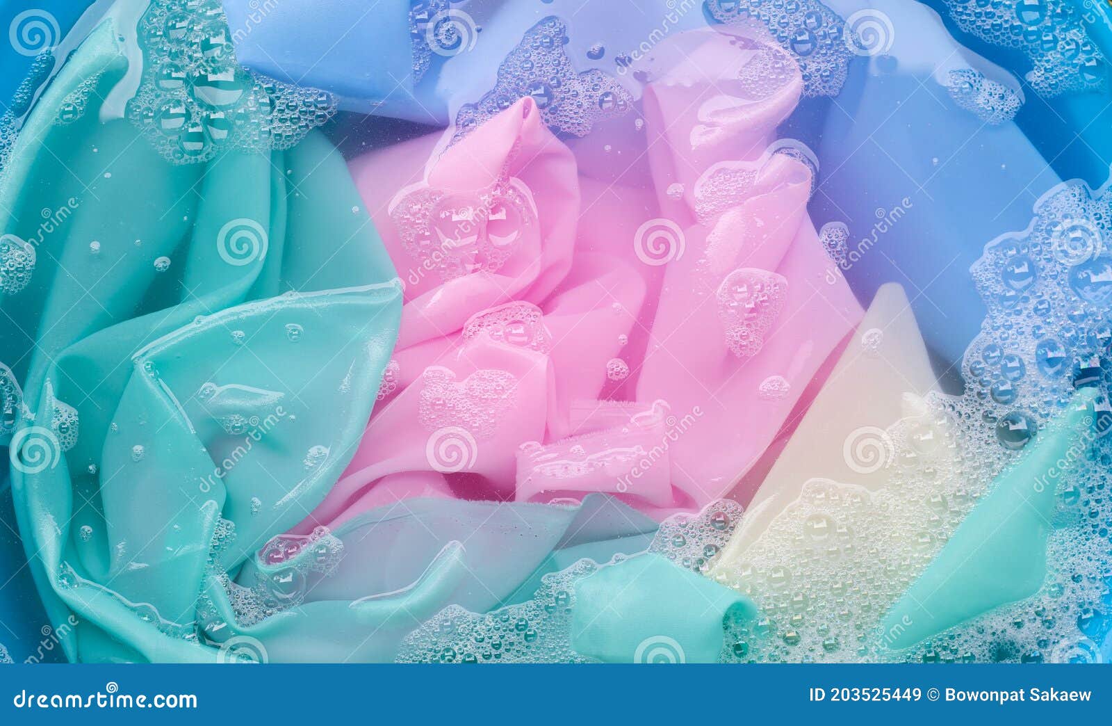 Color Clothes Soak in Powder Detergent Water Dissolution. Laundry ...