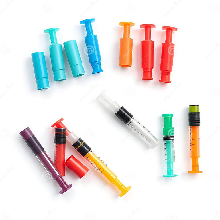 A Color Coded Set of Disposable Syringe Caps Placed on a White Backdrop ...