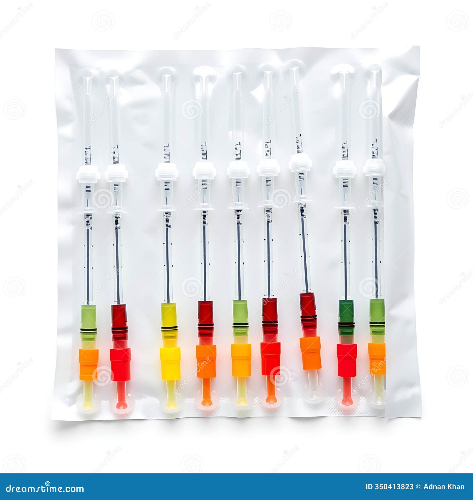 A Color Coded Set of IV Cannulas in Sterile Packaging Isolated on White ...