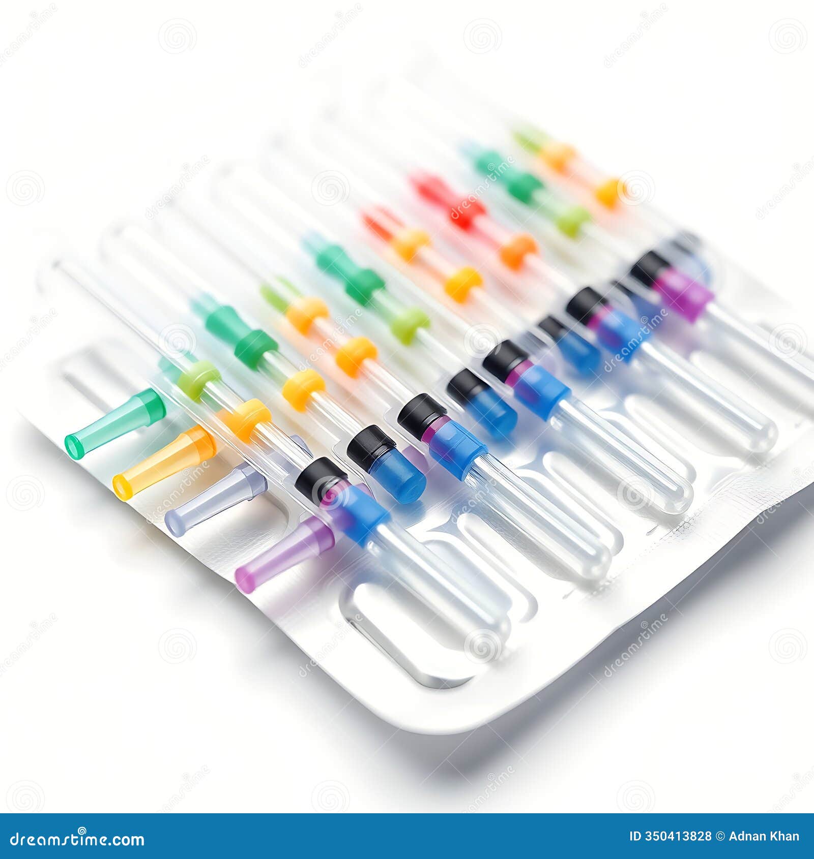 A Color Coded Set of IV Cannulas in Sterile Packaging Isolated on White ...