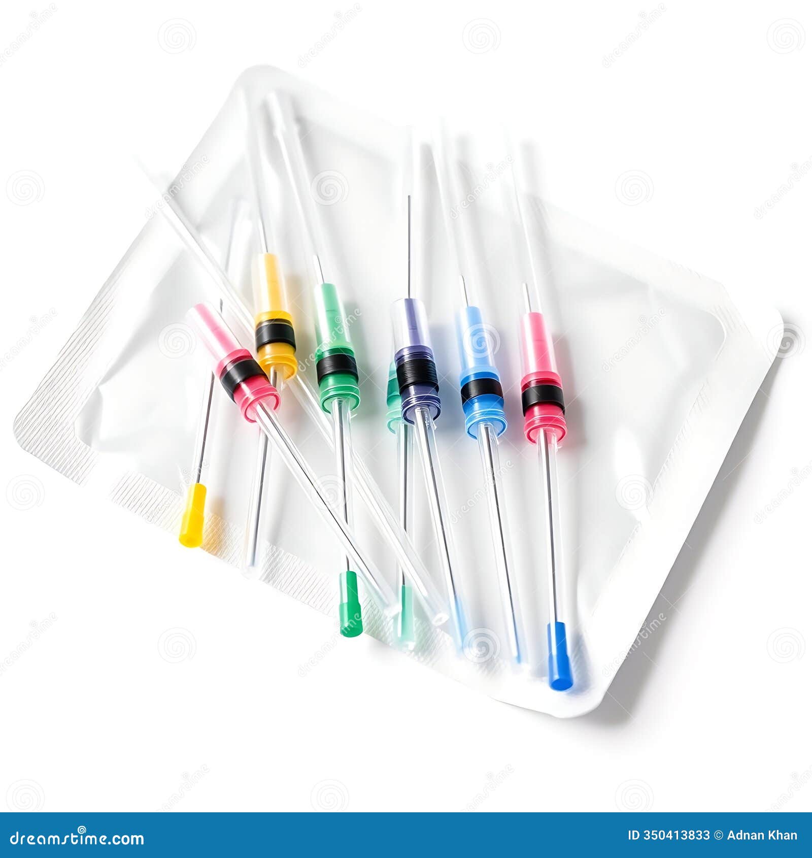 A Color Coded Set of IV Cannulas in Sterile Packaging Isolated on White ...