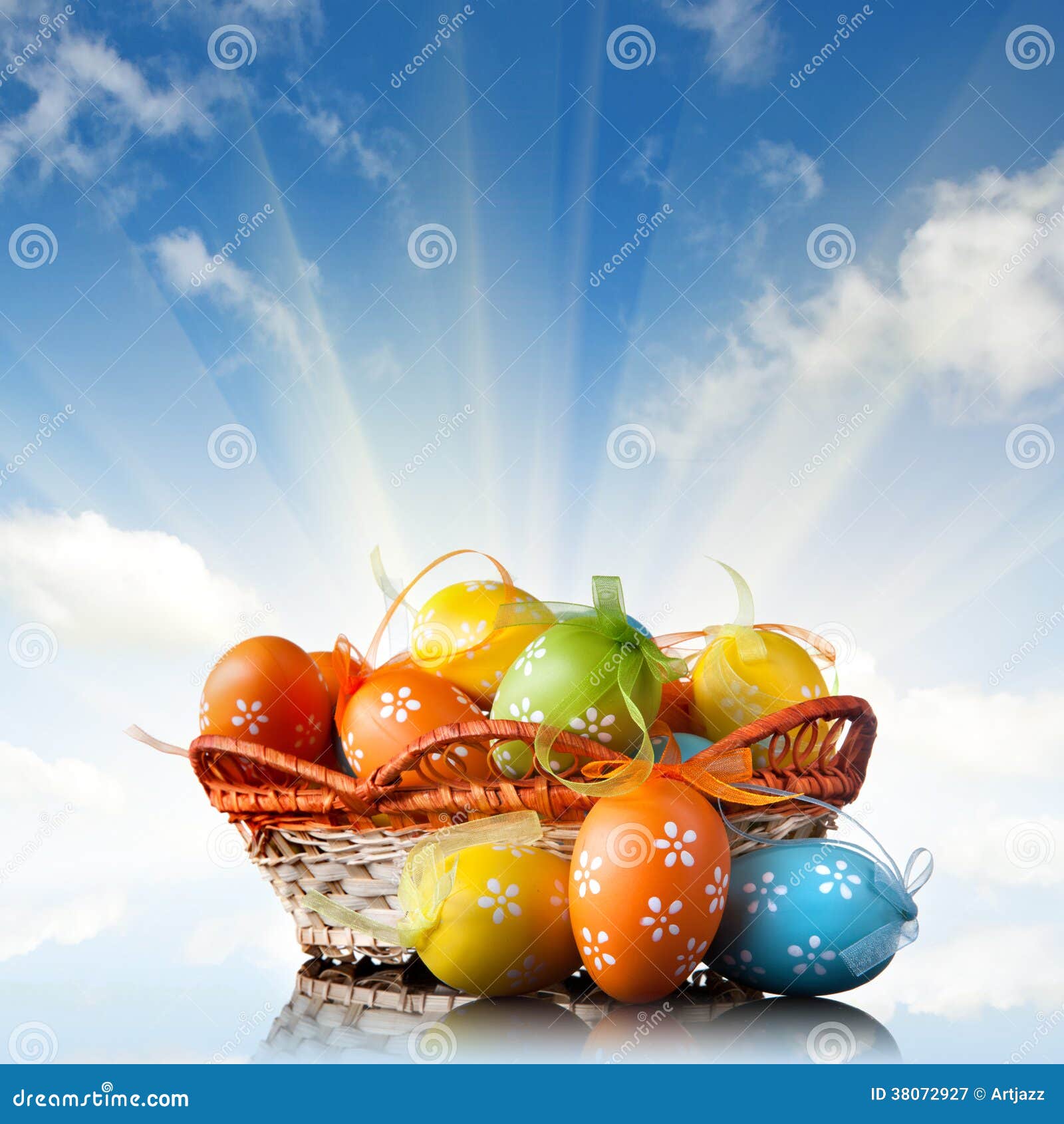 Color Easter Eggs in Basket Against Blue Sky and Clouds Stock Image ...