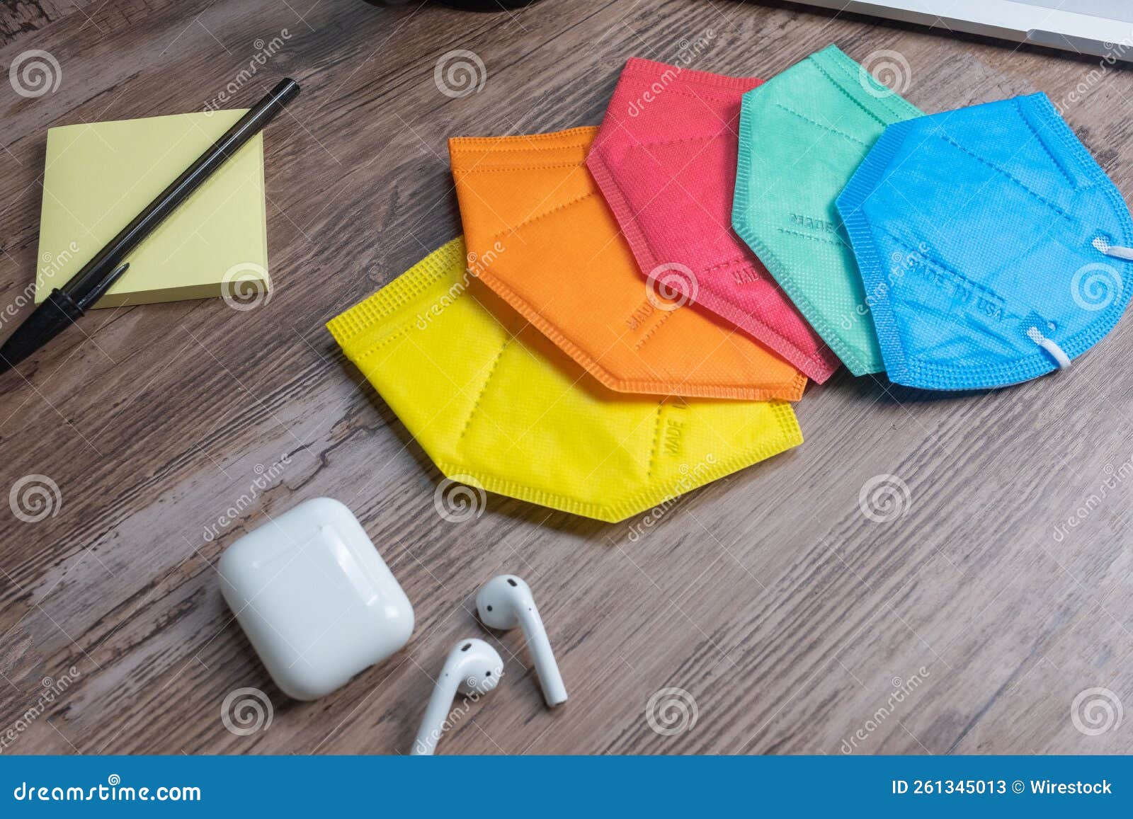 Color Facemasks on a Desktop with Office Elements Stock Image - Image ...