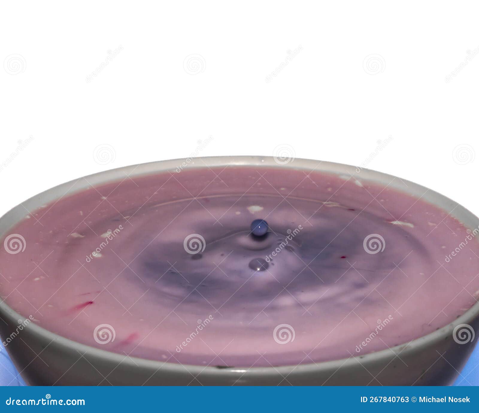 Color Fresh Blue Milk Drops into White Milk in Cup with Light ...