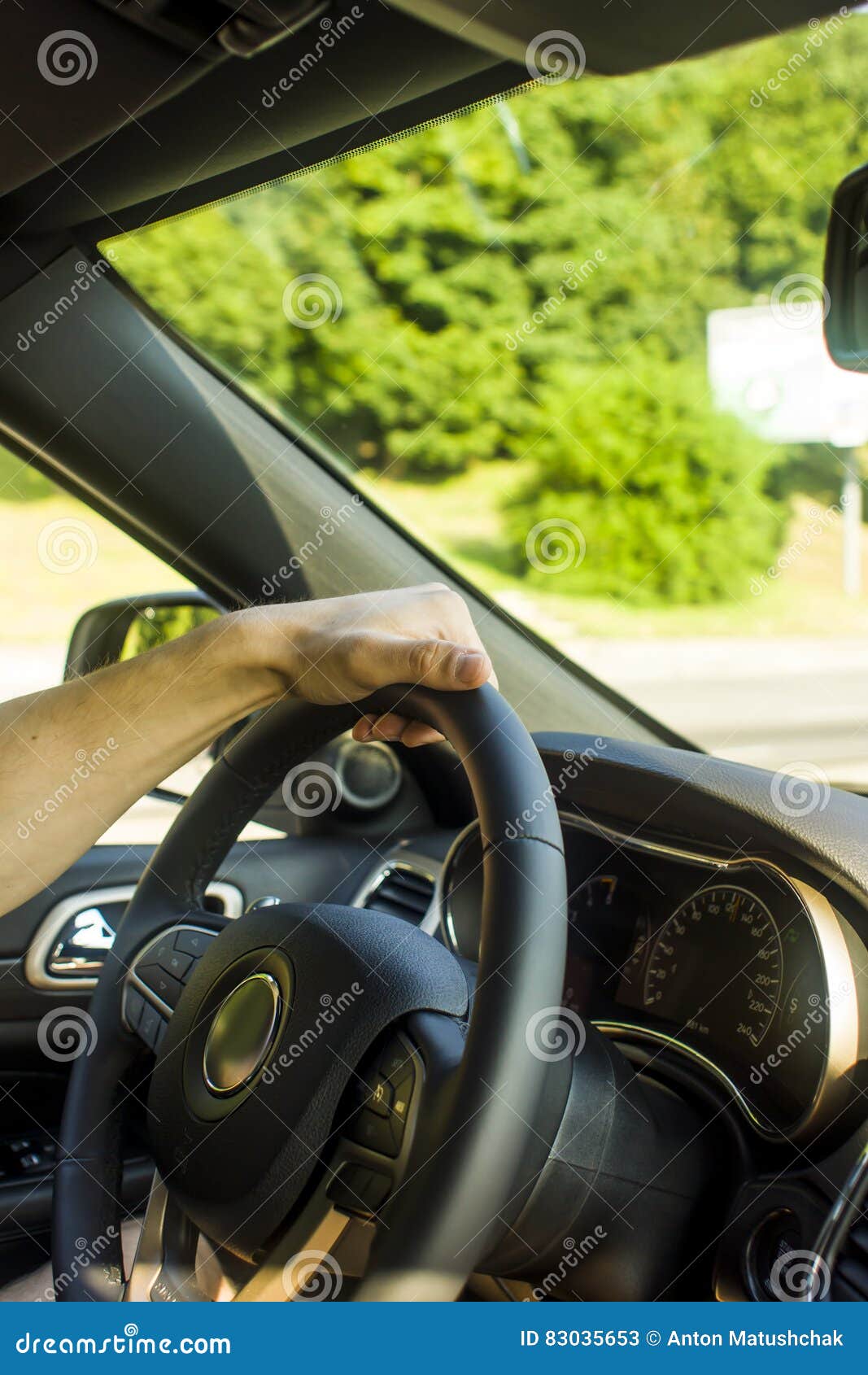 Color Image of Two Hands Holding a Steering Wheel Inside a Car. Stock ...