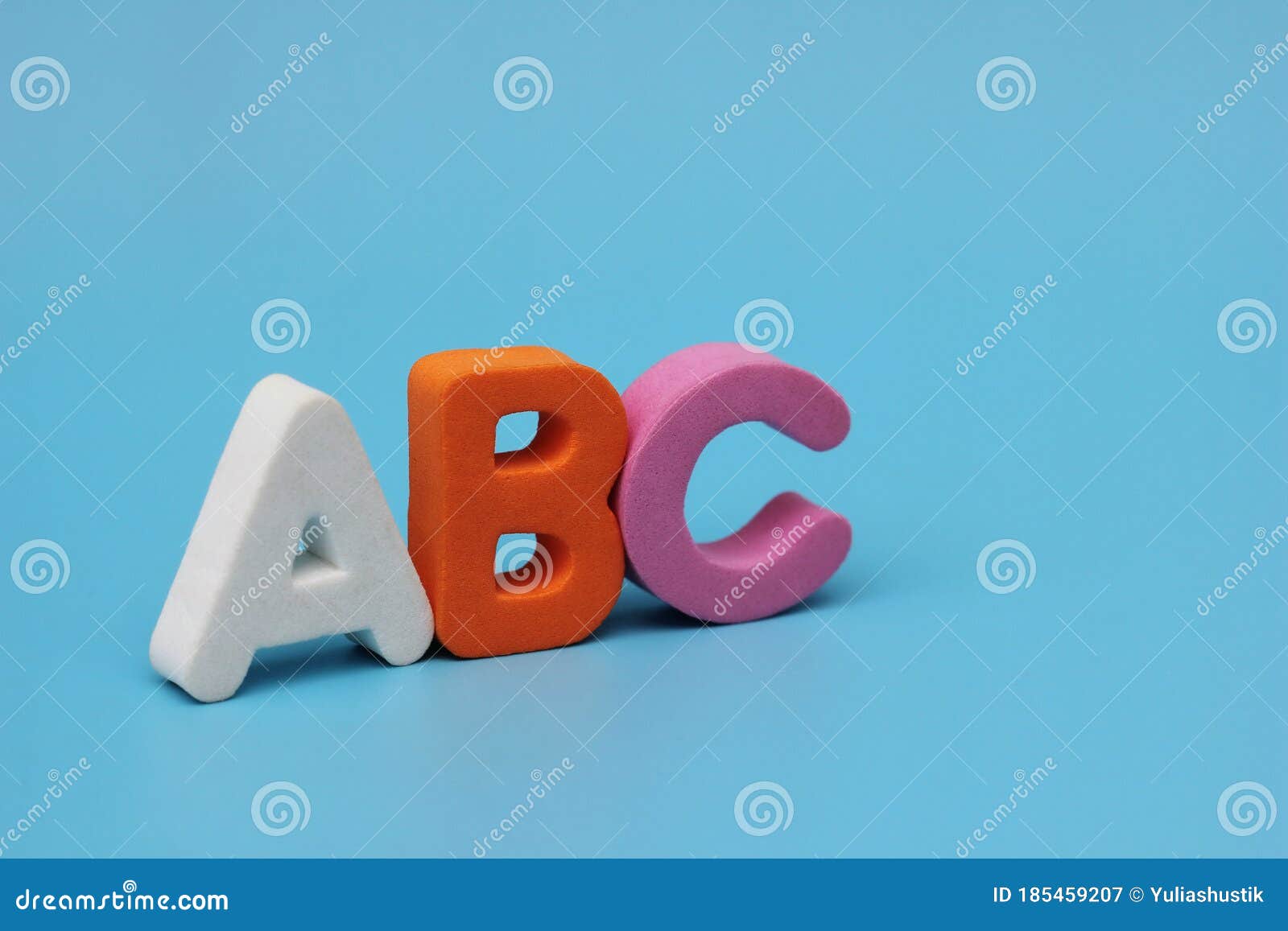 The Color Letters of the ABC are Isolated on a Blue Background. English ...
