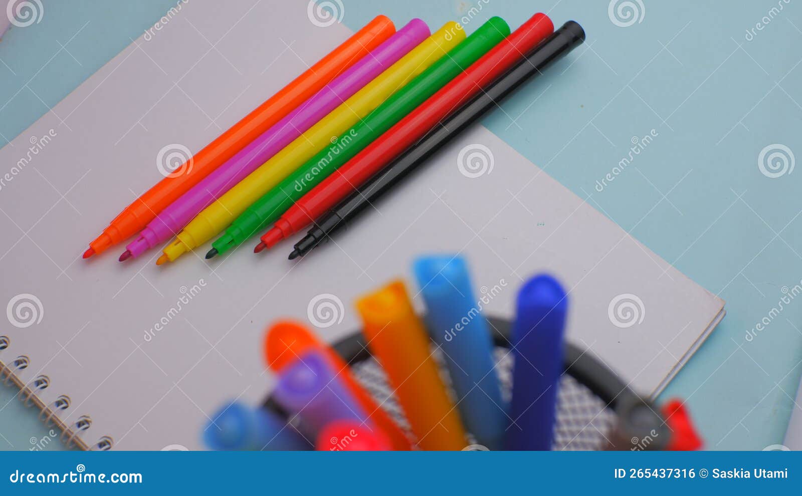 Color Markers on White and Light Blue Paper Stock Photo - Image of ...