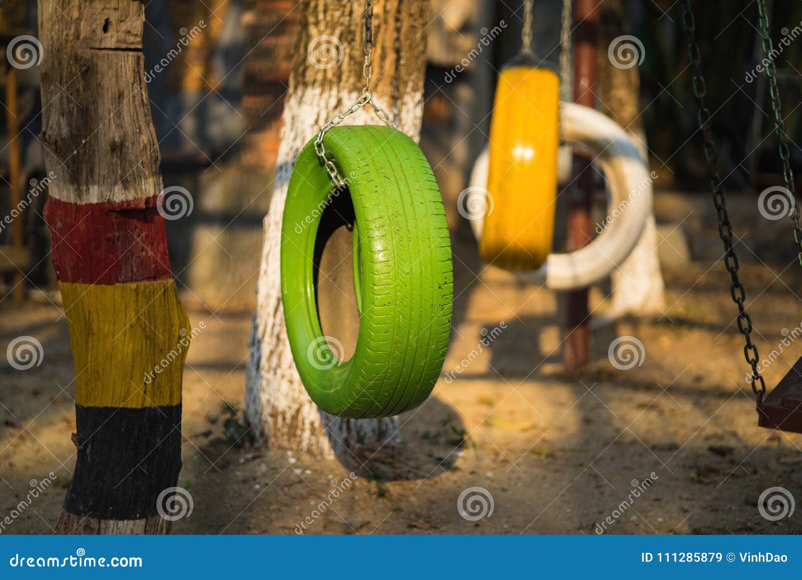 Color Old Car Tire Hanging on Tree at Playground Stock Image - Image of ...