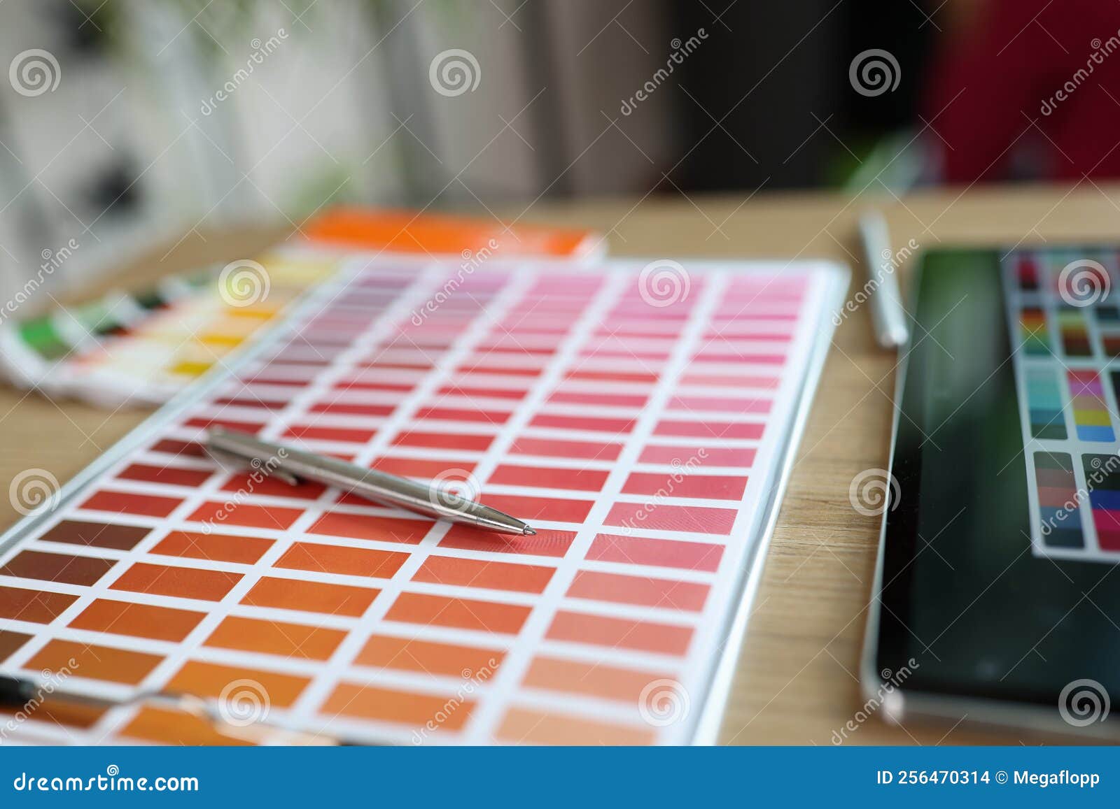 Color Palette with Different Shades and Tablet on Table Stock Photo ...